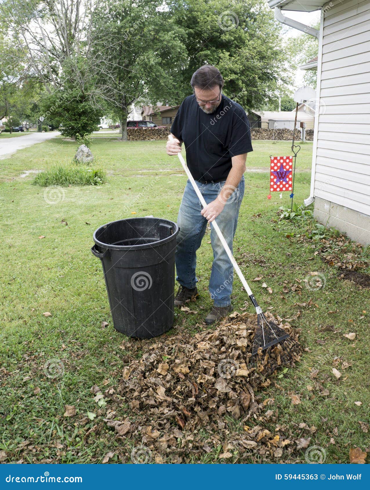 Homeowner Raking Leaves in the Front Yard Stock Image - Image of tool ...