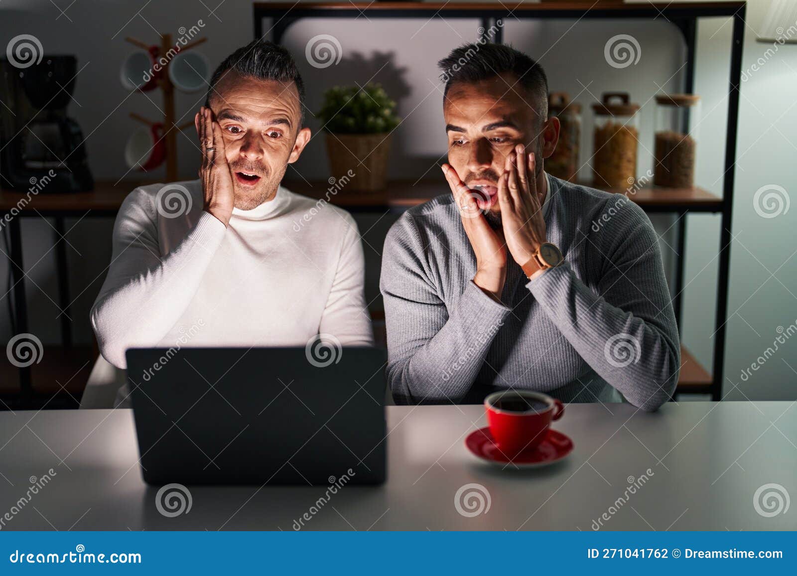 Homosexual Couple Using Computer Laptop Afraid and Shocked, Surprise ...