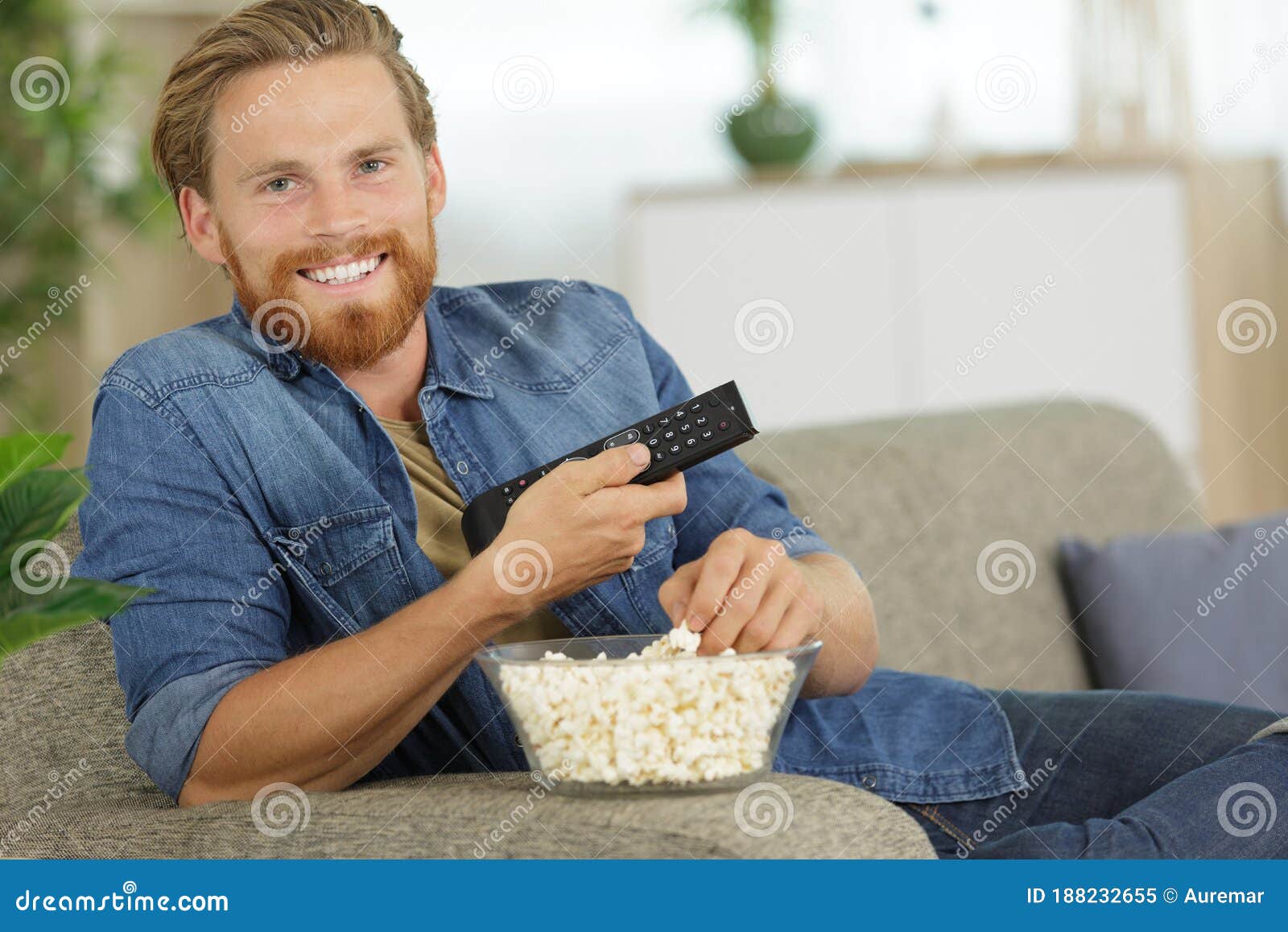 Homsmiling Man with Tv Remote Control at Home Stock Image - Image of ...