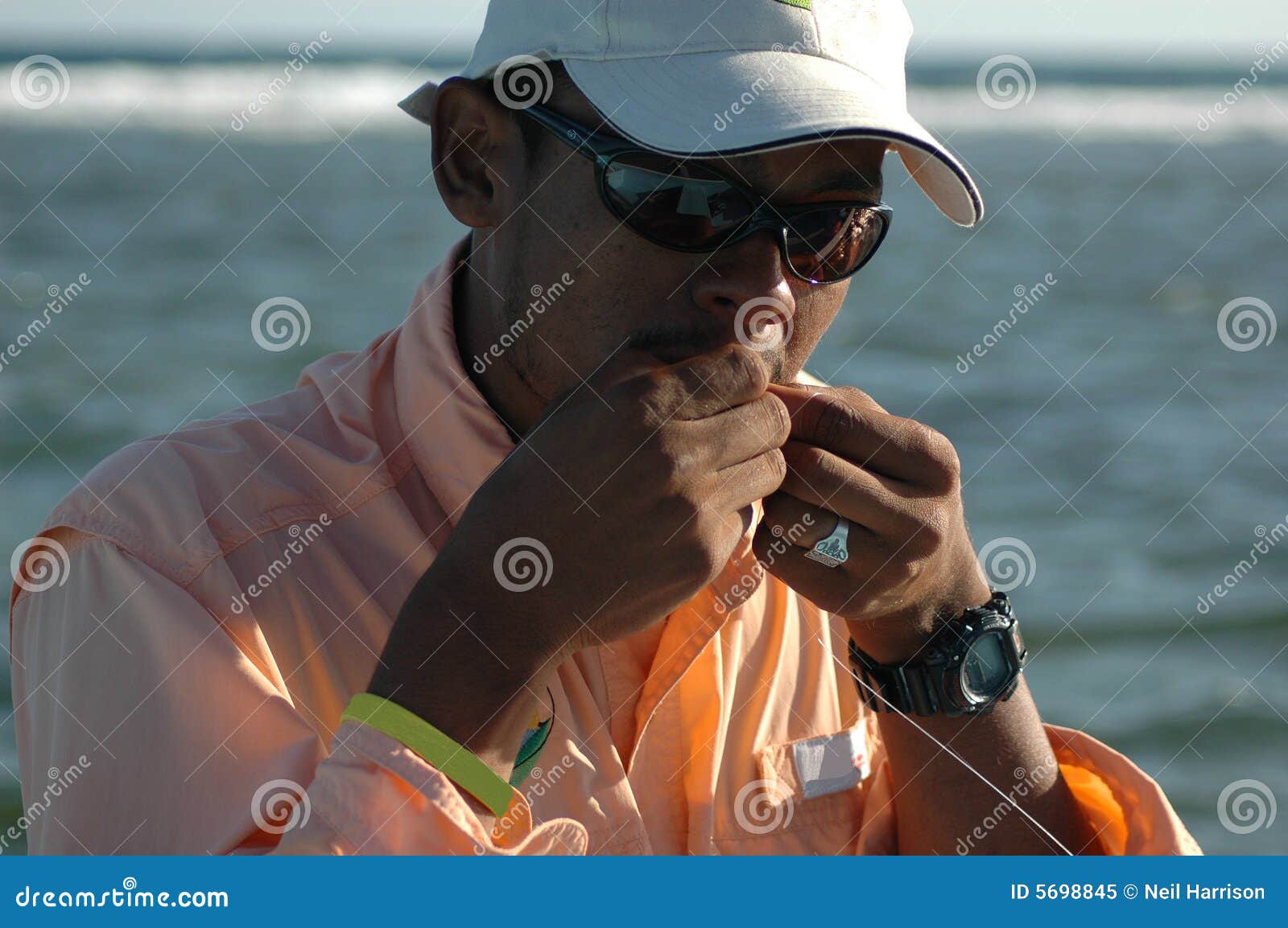 Honduran Guide Attaching Fly with Teeth Stock Image - Image of lagoon ...