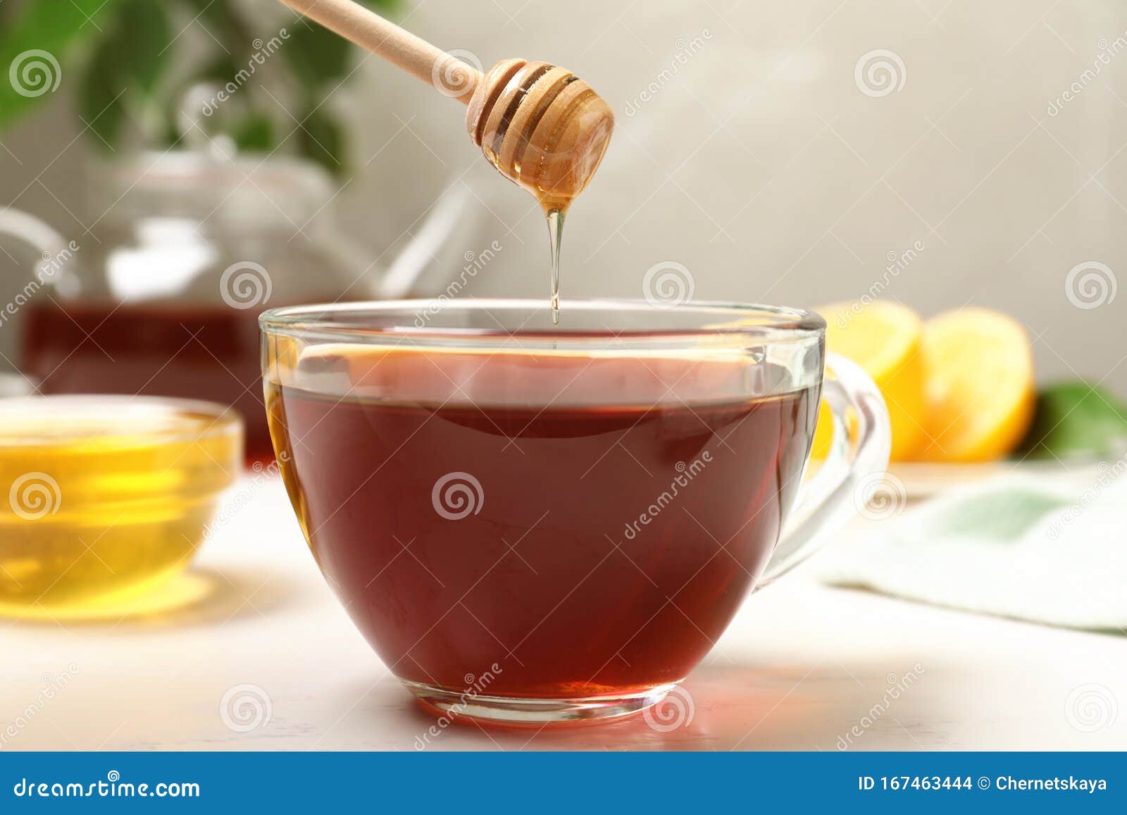 Honey Dripping into Cup of Tea on Table Stock Photo - Image of citrus ...