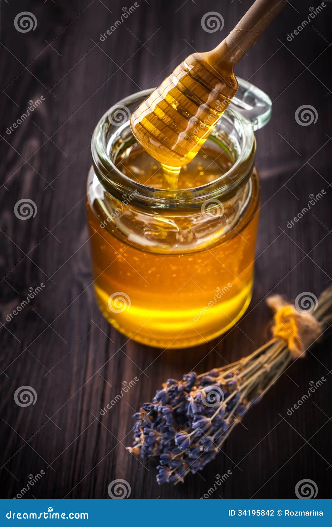 Honey Dripping from a Spoon in a Jar Stock Photo - Image of dipper ...