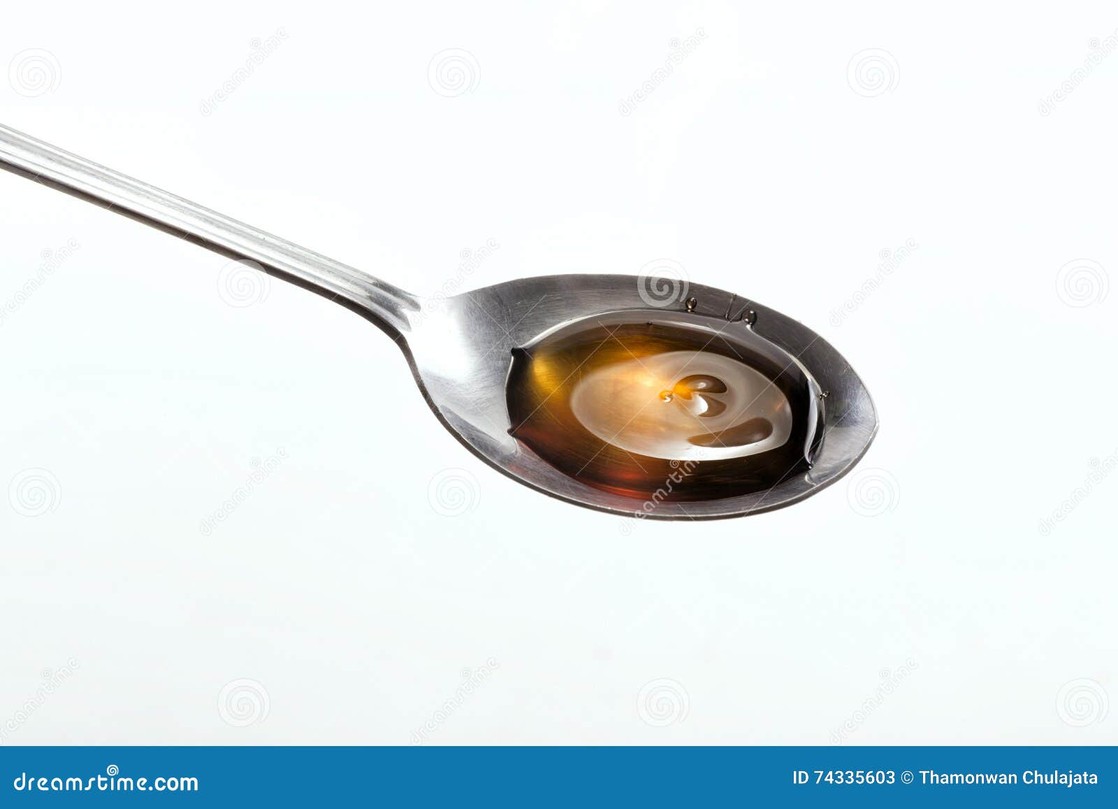 Honey drops on a spoon stock image. Image of calories - 74335603