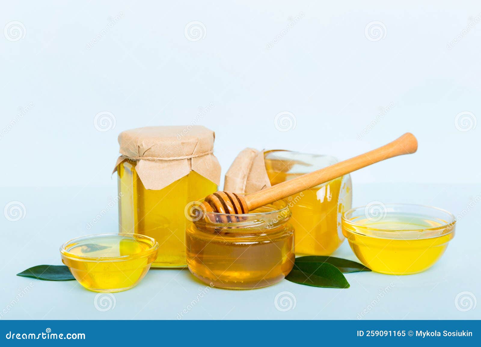 Honey in Jar with Leaves and Honey Dipper on Colored Background Top ...