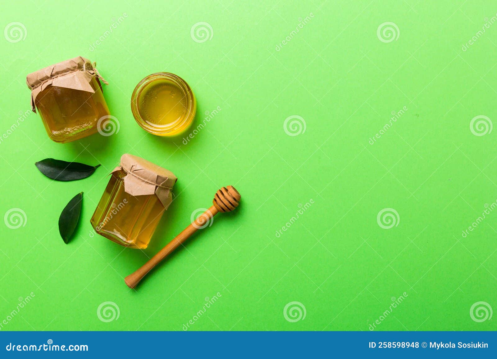 Honey Jar With Wooden Honey Dipper On White Background Top View With