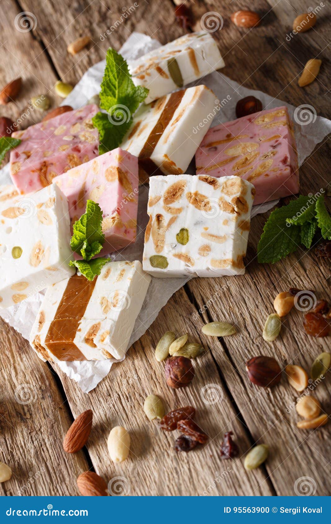 Honey Nougat with Nuts Decorated with Mint Closeup. Vertical Stock ...