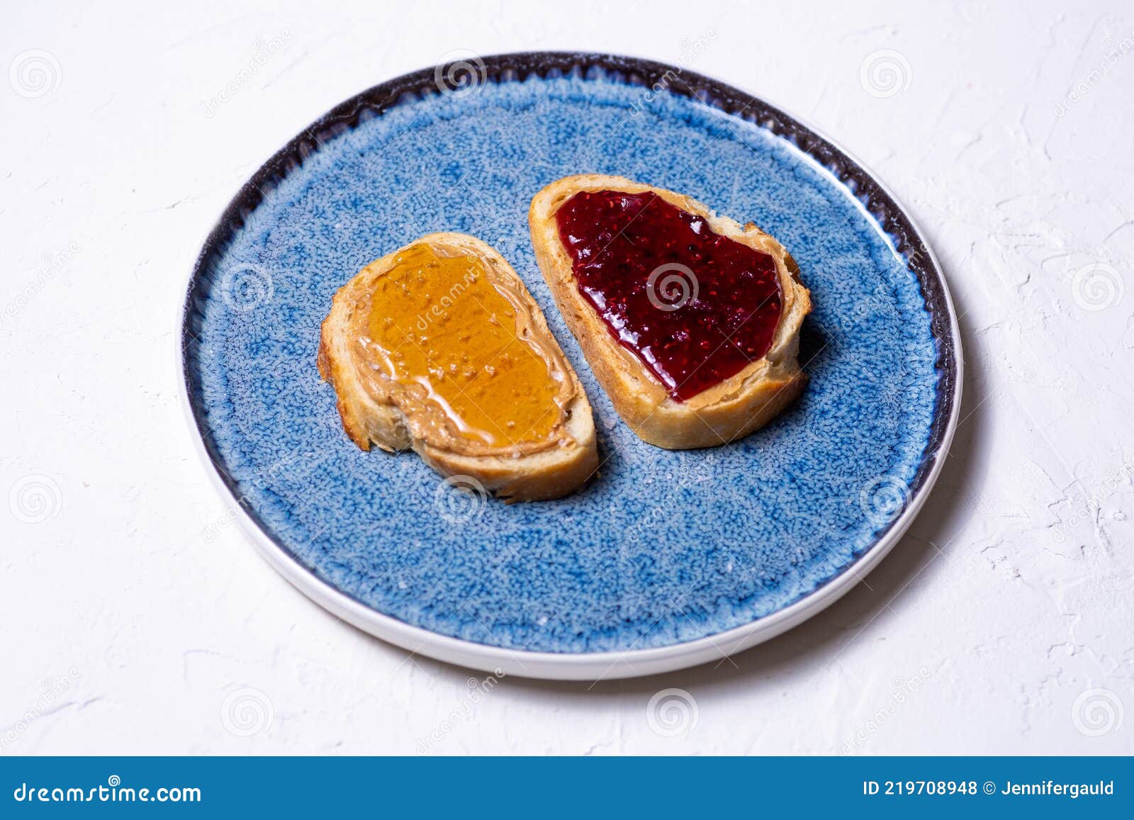 Honey, Raspberry Jam and Peanut Butter on White Toast Stock Photo ...