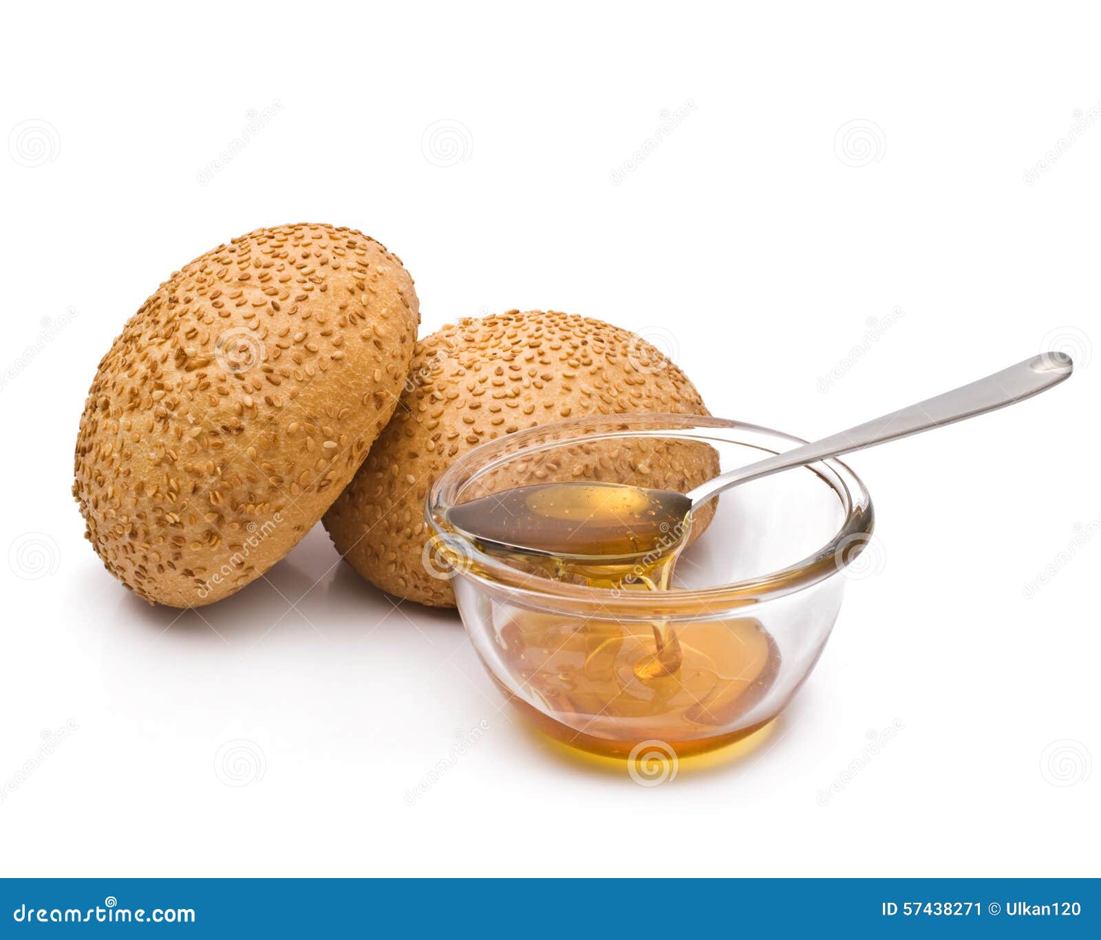 Honey on a spoon with bun stock image. Image of seed - 57438271