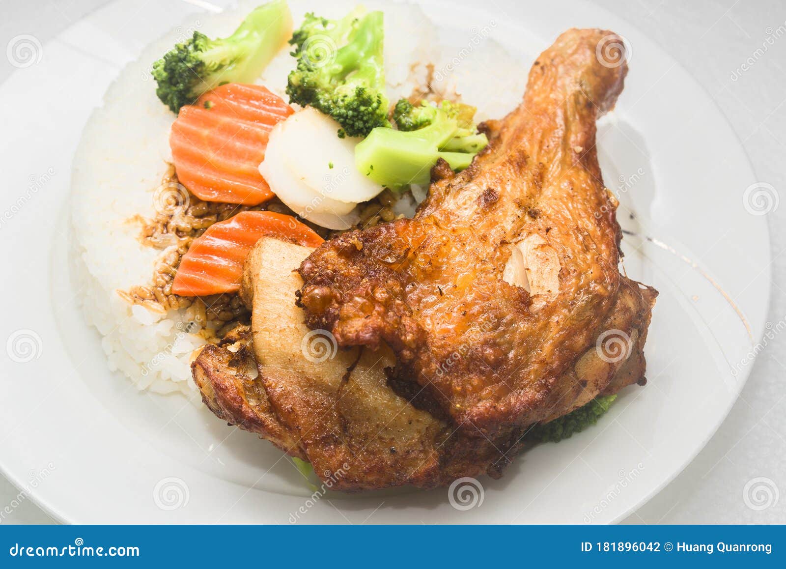 A Hong Kong Style Chicken Drumstick Rice on White Background Stock ...
