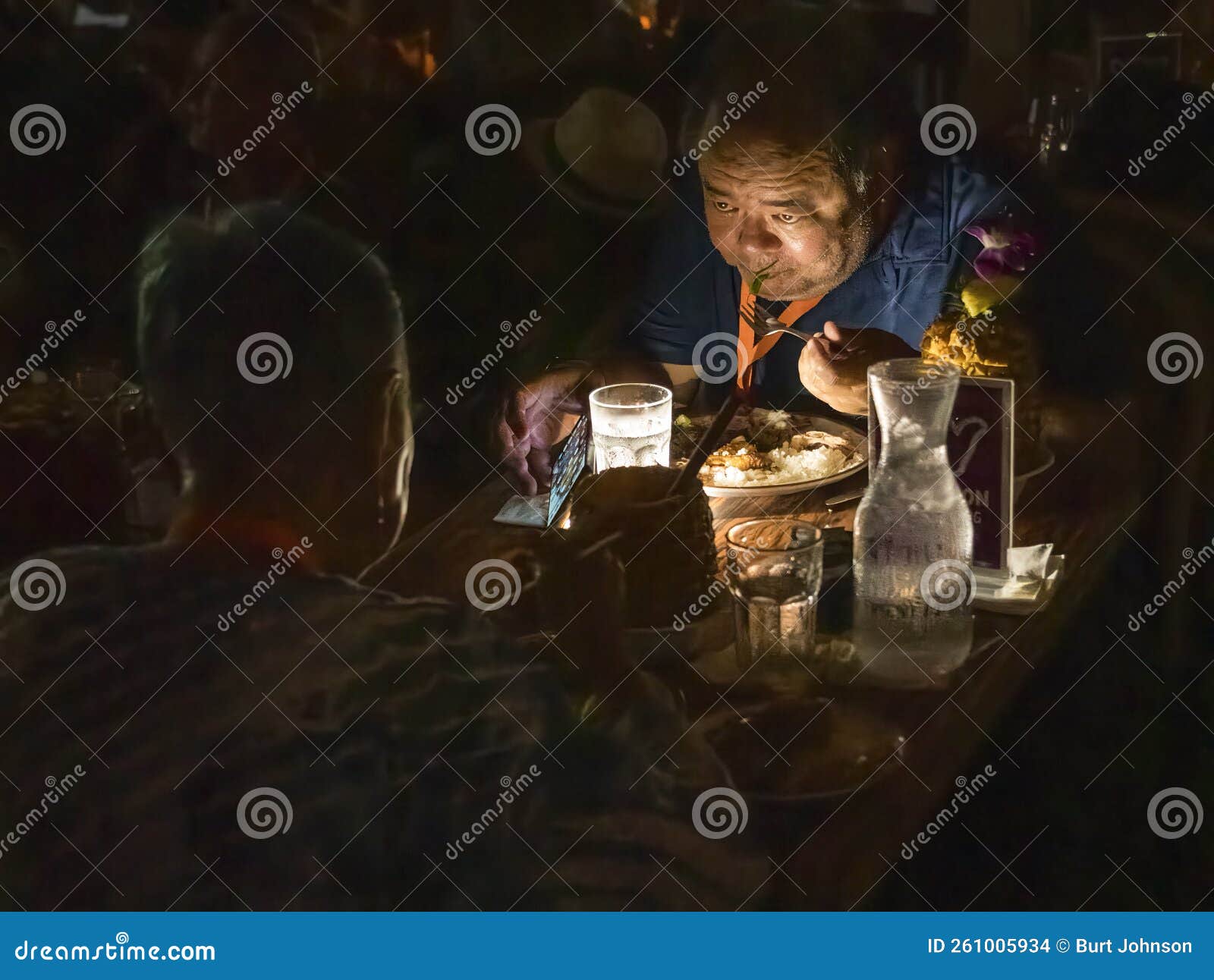 Honolulu, Hawaii, Oct 19, 2022- Shakacon - Man Eats Dinner by Light of ...