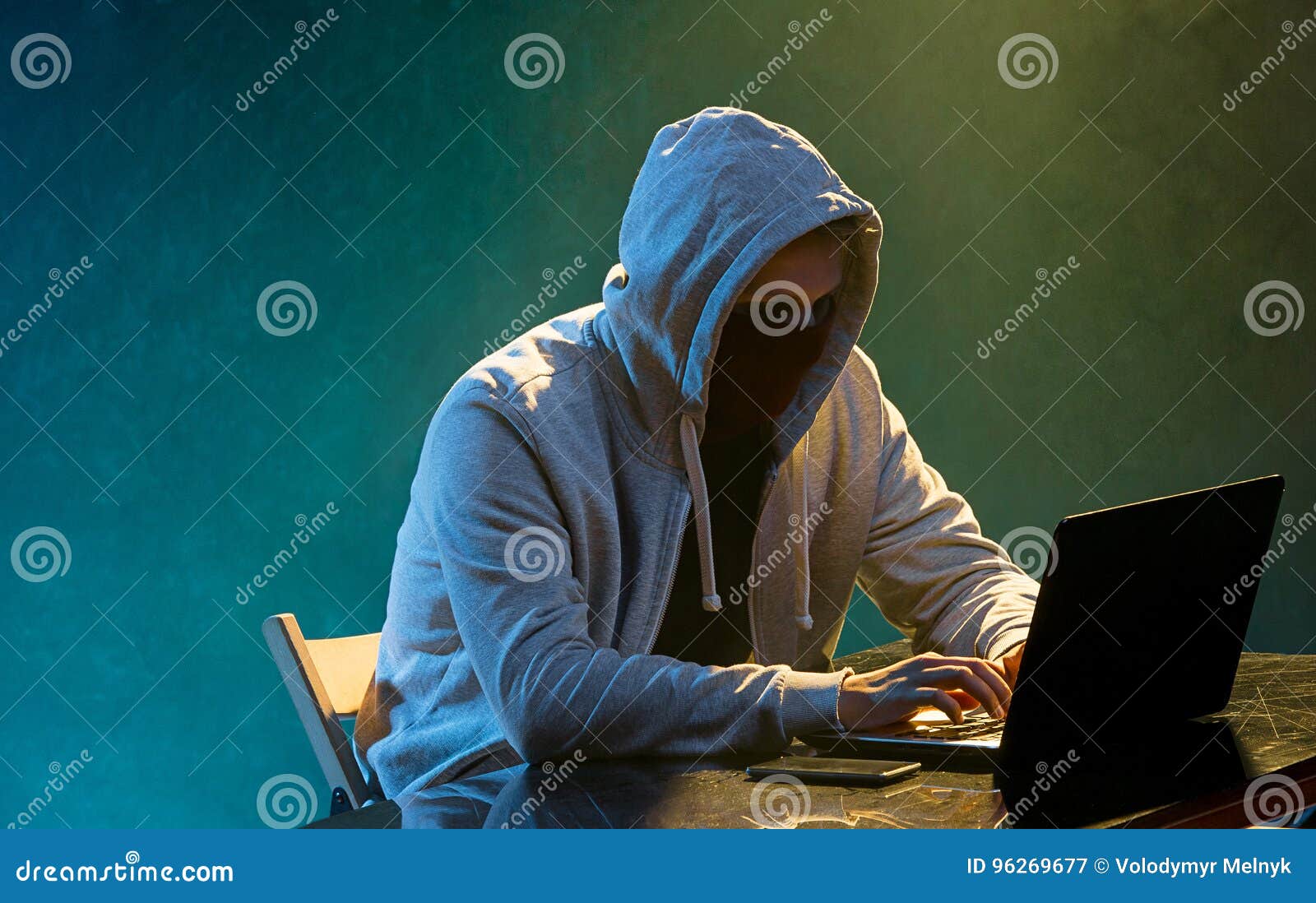 Hooded Computer Hacker Stealing Information with Laptop Stock Image ...