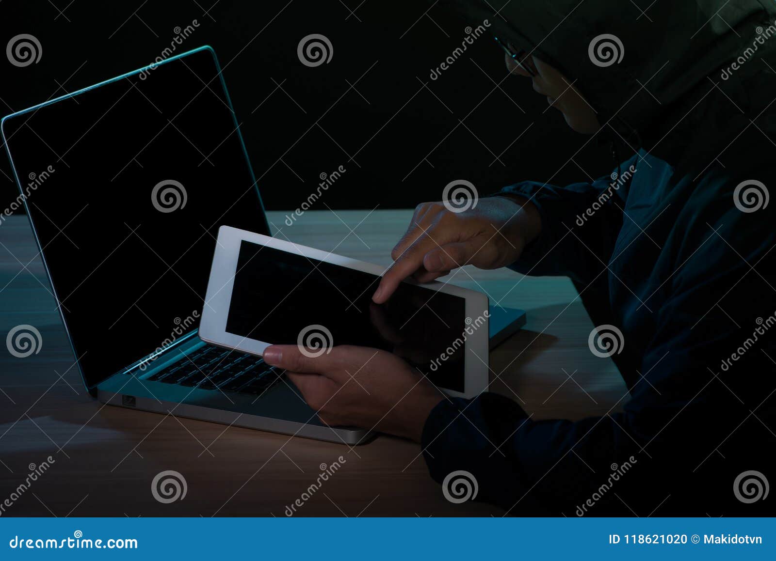 Hooded Cyber Crime Hacker Using Digital Tablet Internet Hacking Stock ... Hooded Cyber Crime Hacker Using Digital Tablet Internet Hacking Stock ...