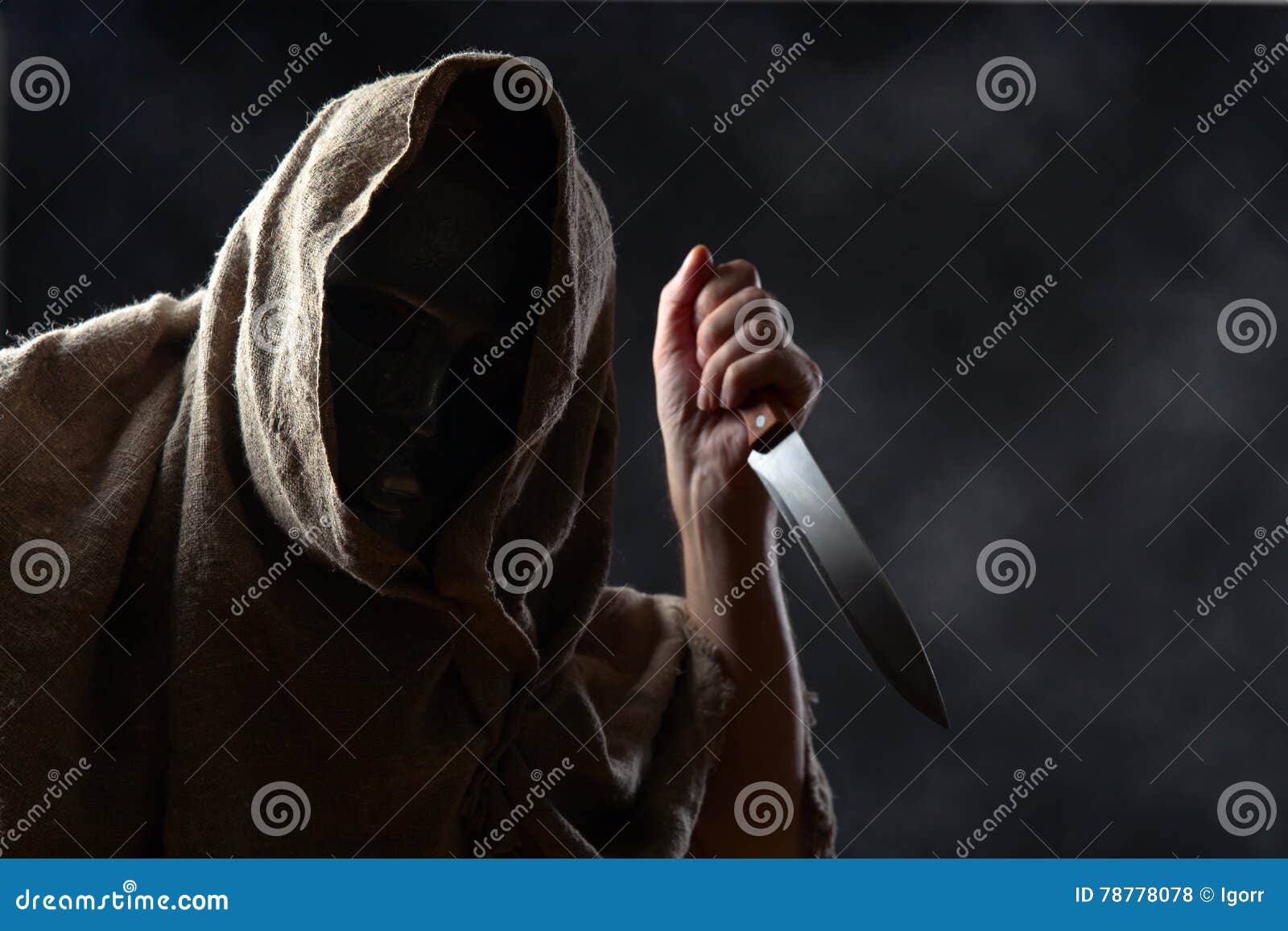 Hooded Man in Mask with a Knife Stock Photo - Image of murderer, dark ...