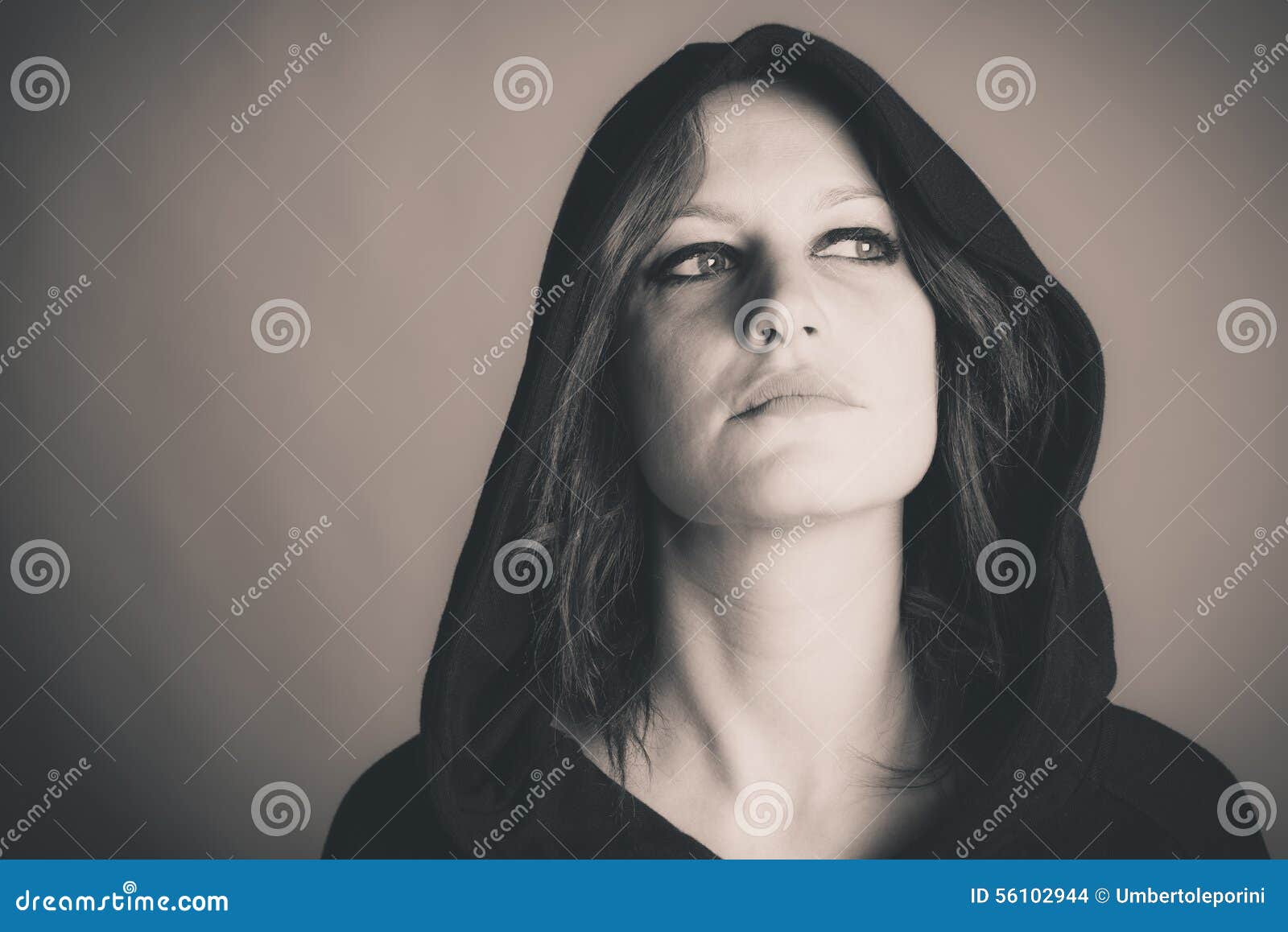 Hooded scheming woman stock photo. Image of glance, beautiful - 56102944