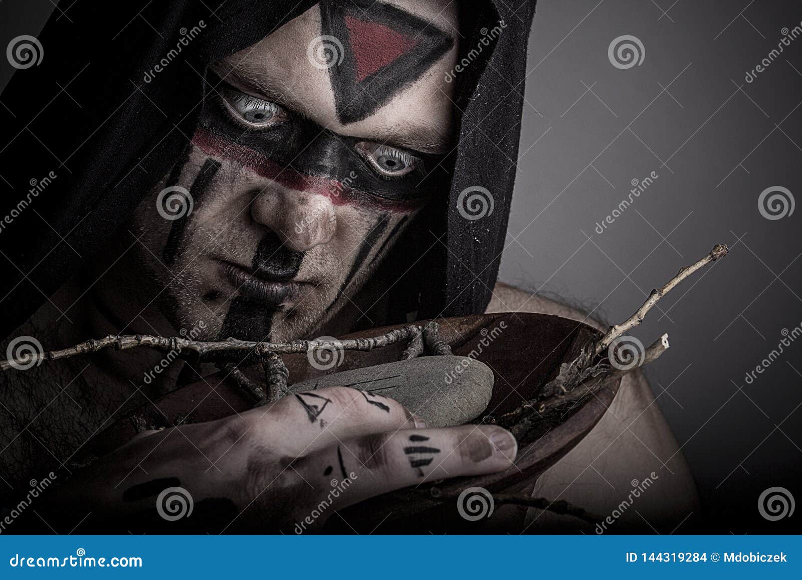 A Hooded Shaman is Doing a Dark Ritual Stock Photo - Image of performs ...