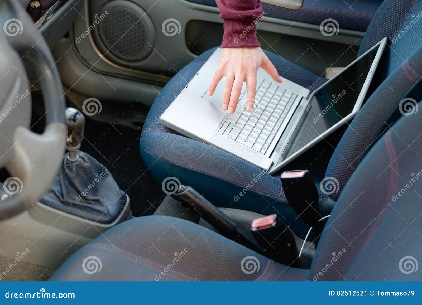 Hooded Thief Stealing a Computer Laptop from a Parked Car Stock Image ...