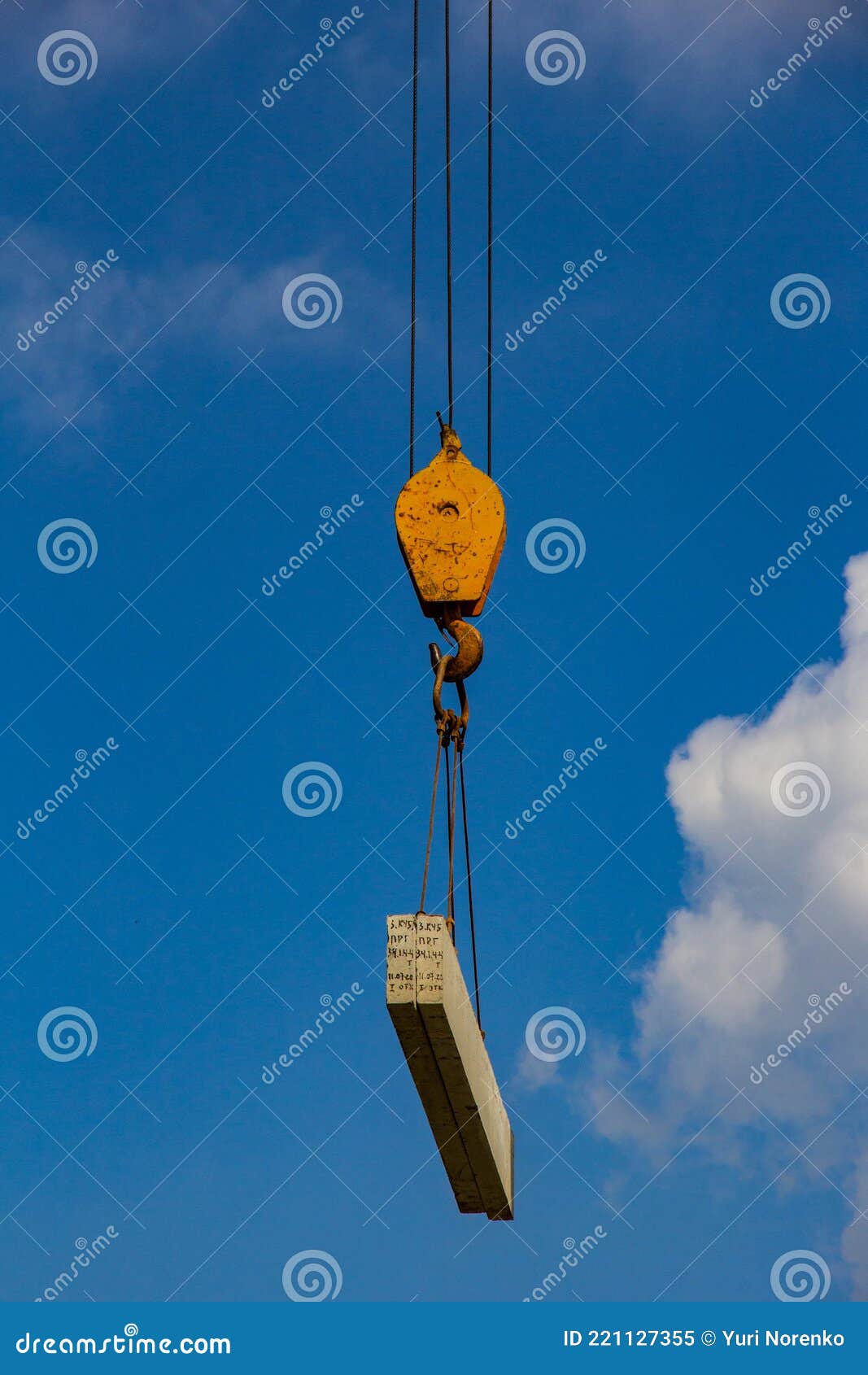 The Hook of a Construction Crane with a Suspended Load on the ...