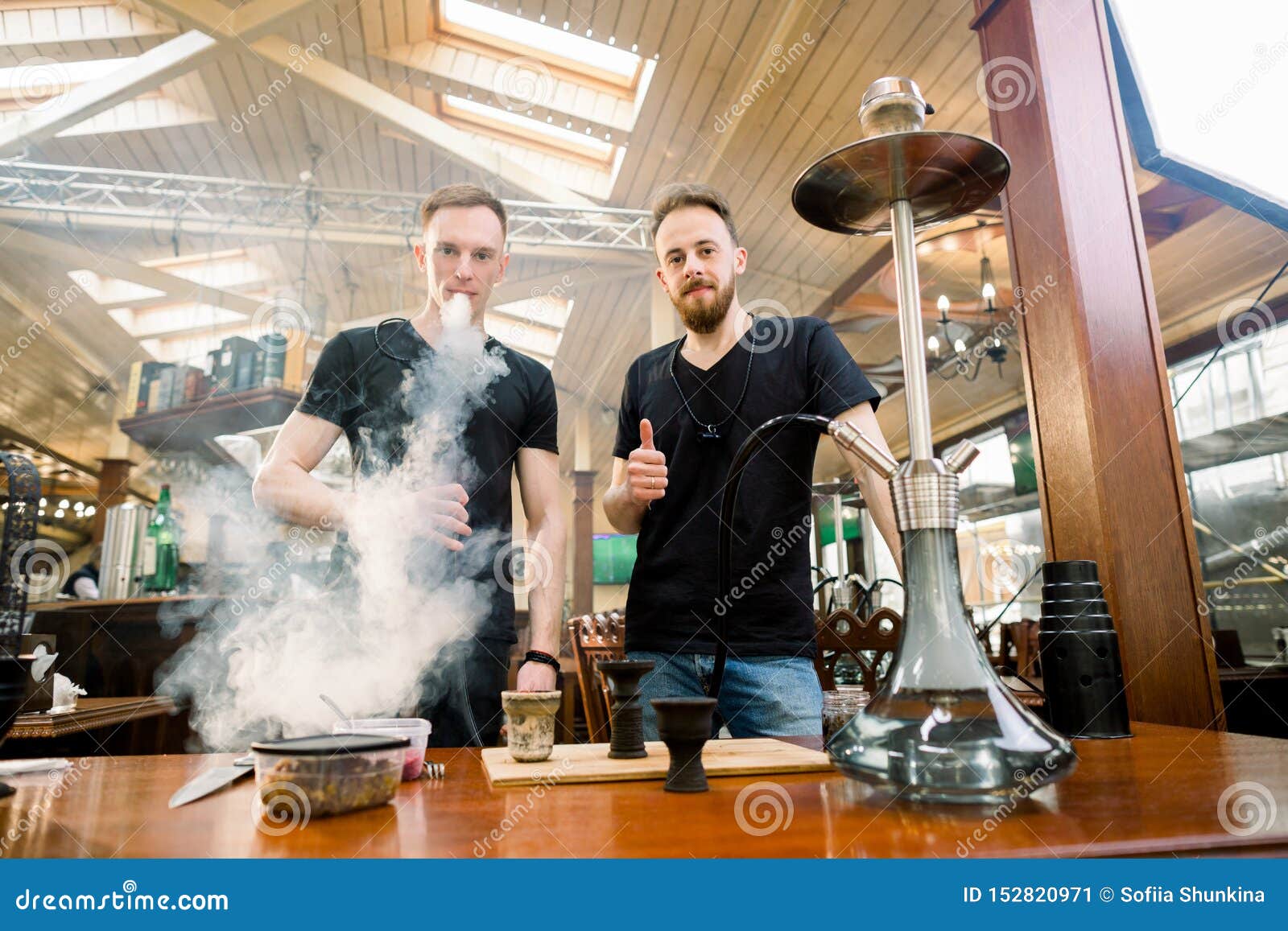 Hookah in the Process Preparations. Two Young Boys Prepare Hookah Sisha ...