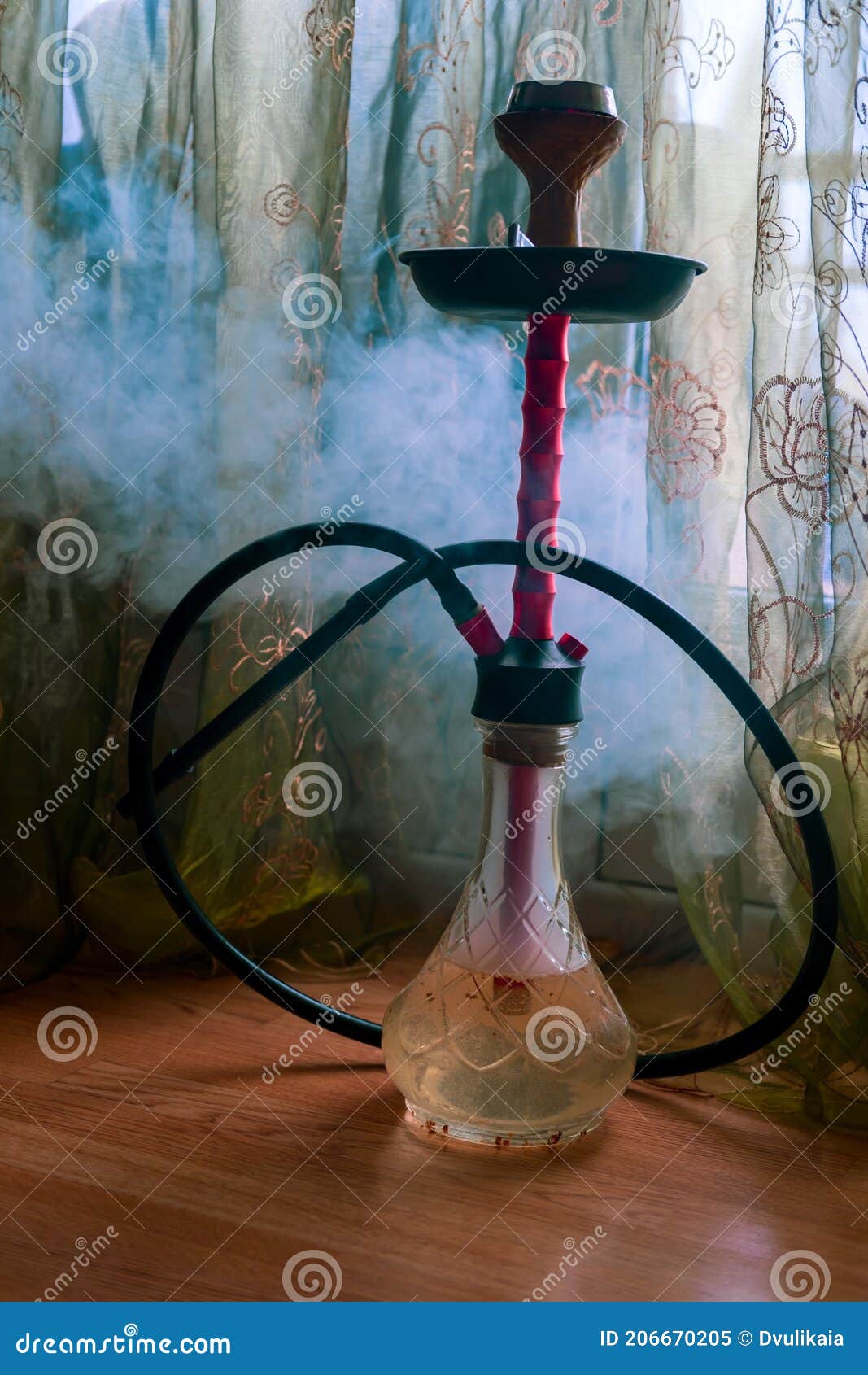 Hookah with Smoke on a Blurred Textile Background. Oriental Hookah ...