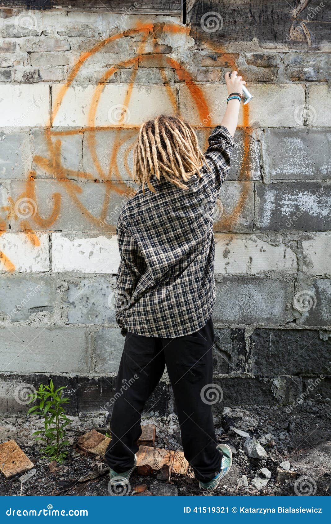 Hooligan Painting Graffiti on the Building Stock Image - Image of paint ...