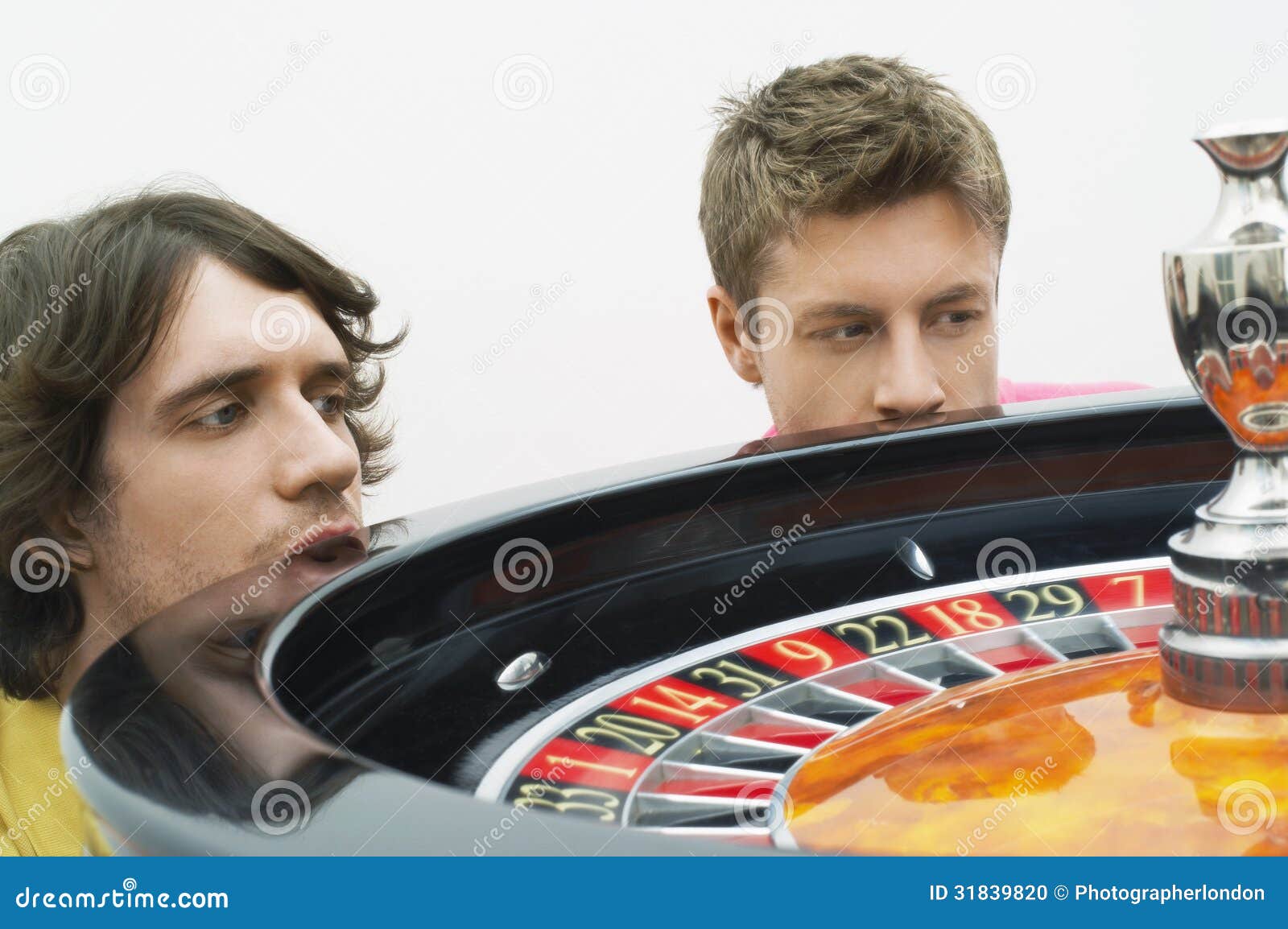 Hopeful Men Watching Roulette Wheel Spin Stock Photo - Image of ...