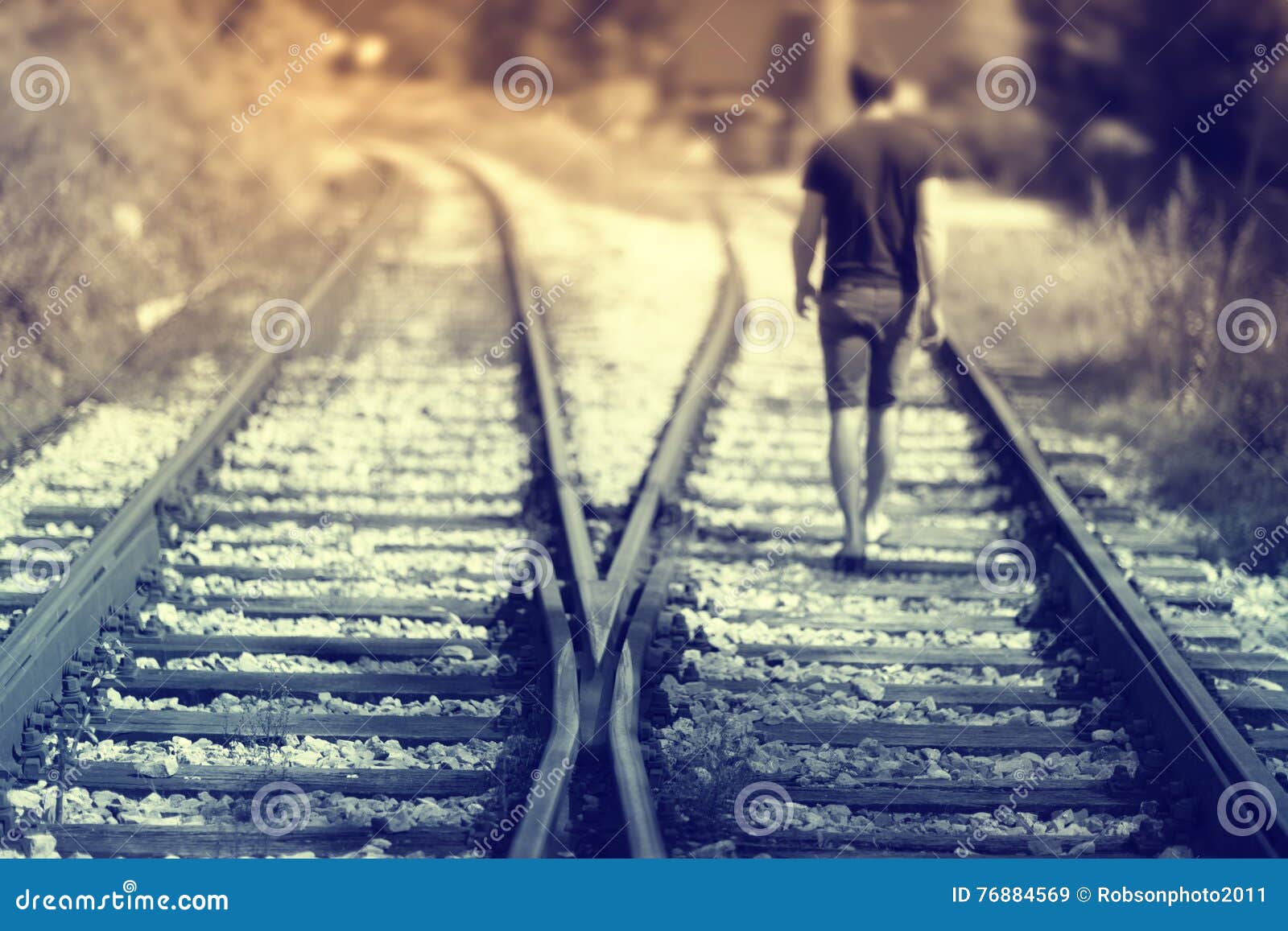 Hopeful walking on rails stock image. Image of trouble - 76884569