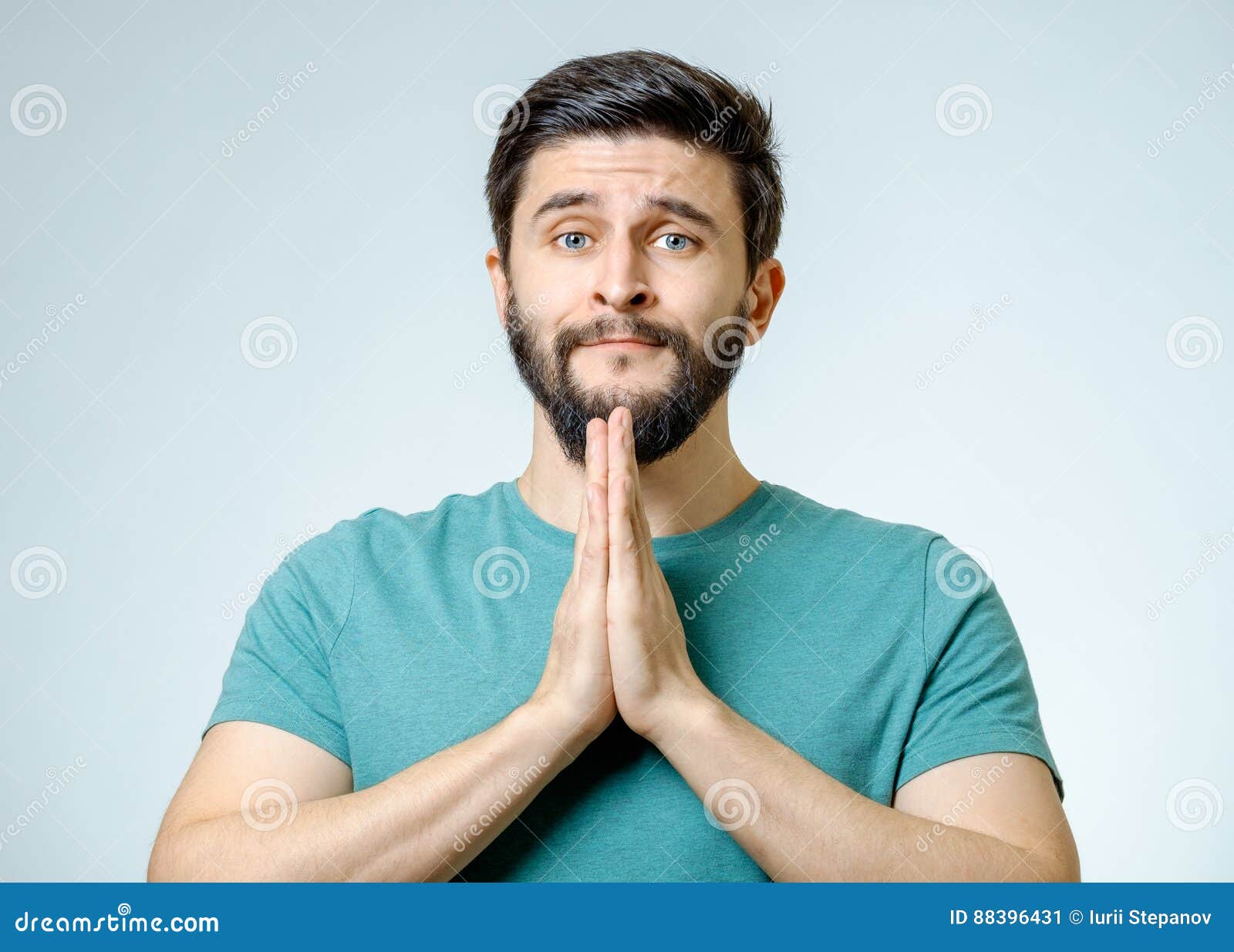 Hopeful young man praying stock image. Image of fashion - 88396431