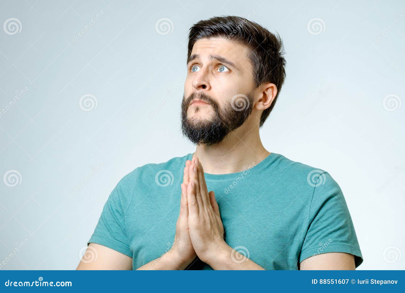 Hopeful young man praying stock image. Image of hipster - 88551607