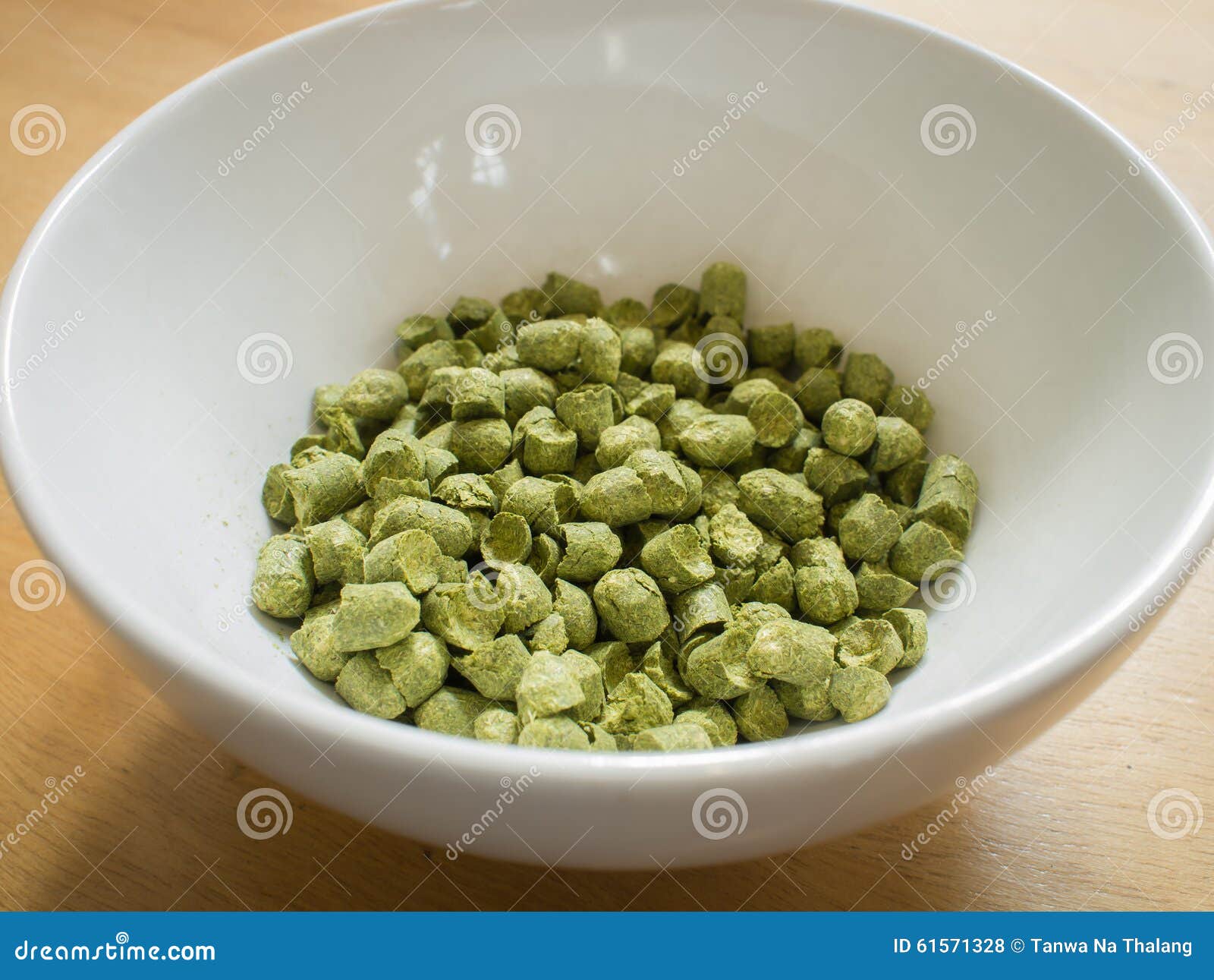 Hops pellets in white bowl stock photo. Image of brewing - 61571328