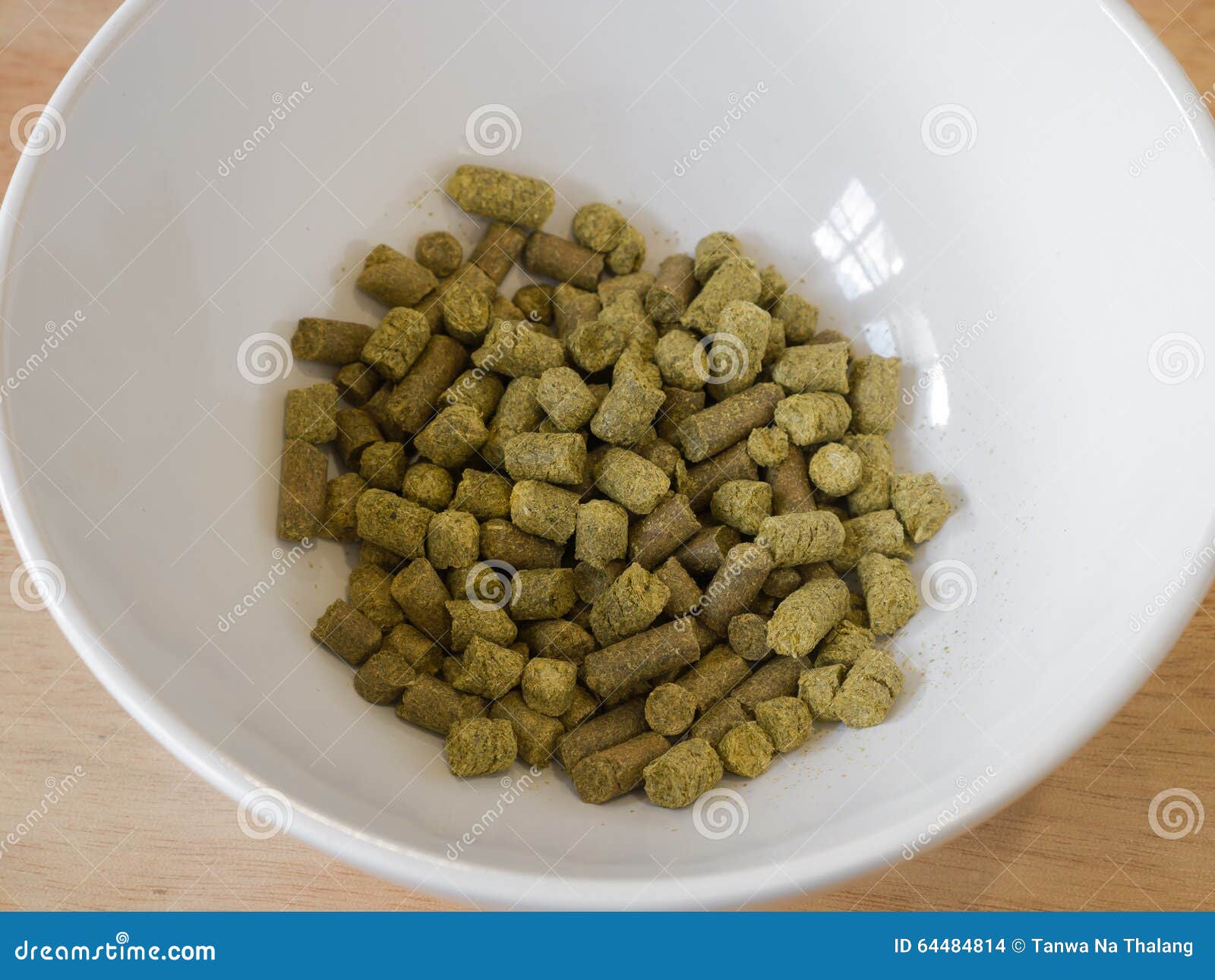Hops pellets in white bowl stock photo. Image of flower - 64484814