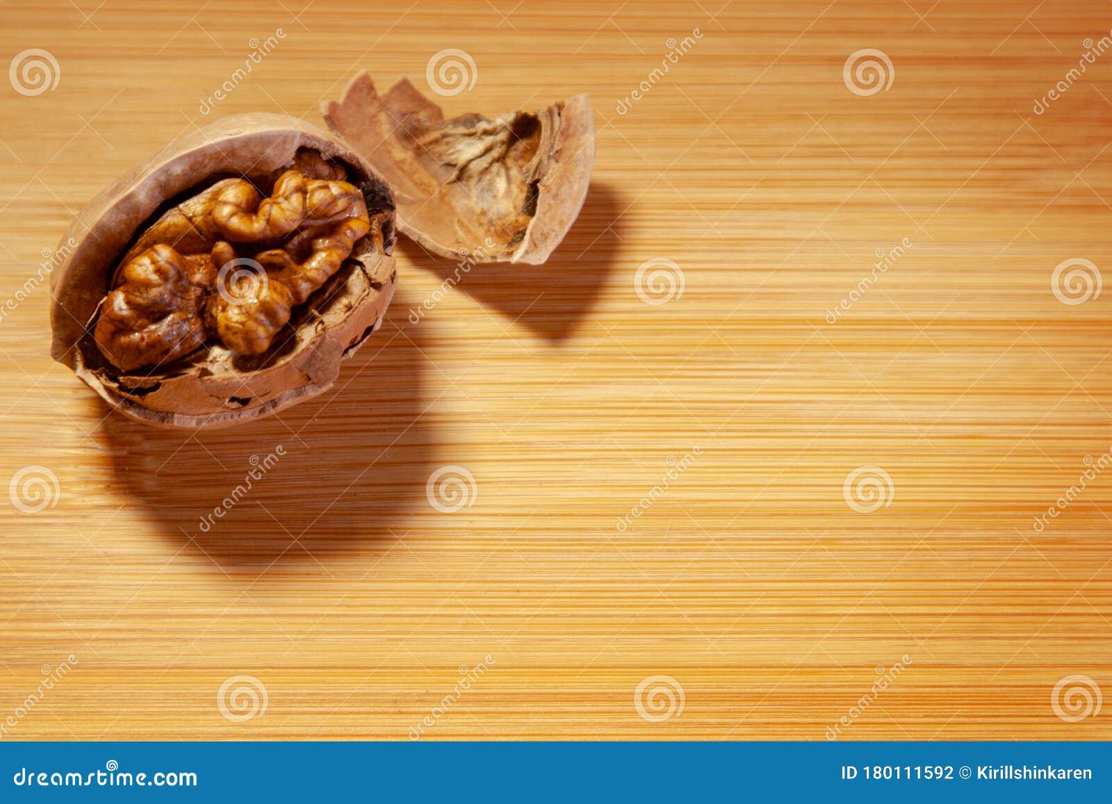 The Horizontal Frame. Three Walnuts are Lying on a Bamboo Board, One is ...