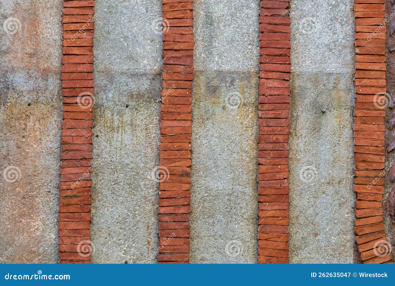 Horizontal Image of a 4 Columns of Red Bricks in Front of Gray Cement ...