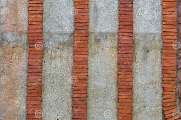 Horizontal Image of a 4 Columns of Red Bricks in Front of Gray Cement ...