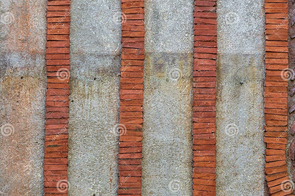 Horizontal Image of a 4 Columns of Red Bricks in Front of Gray Cement ...