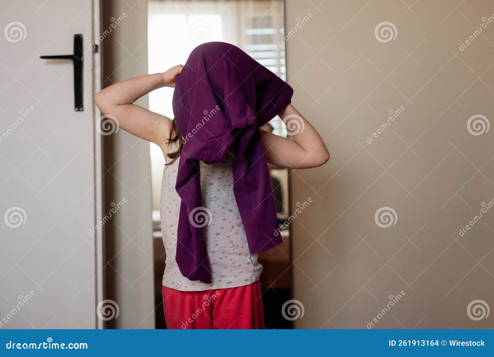 Horizontal Image of a Little Girl Getting Dressed at Home Stock Photo ...