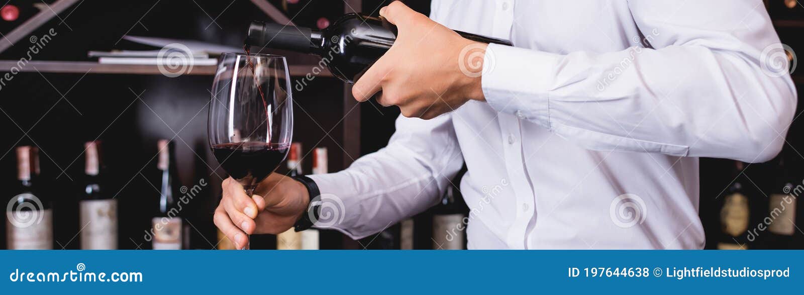 Horizontal of Sommelier Pouring Wine in Stock Photo - Image of ...