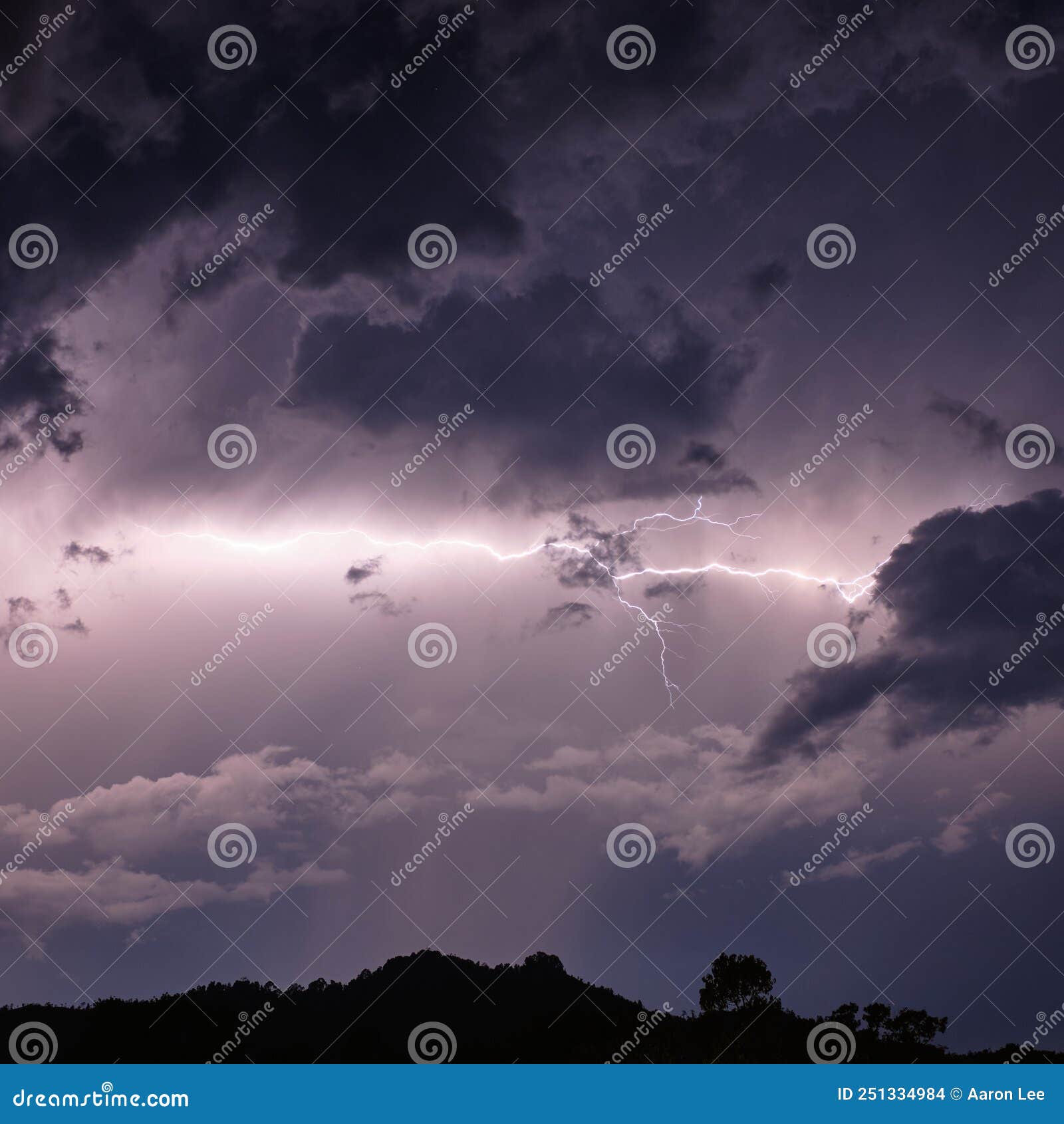 Horizontal Lightning Bolt among Storm Clouds Stock Photo - Image of ...