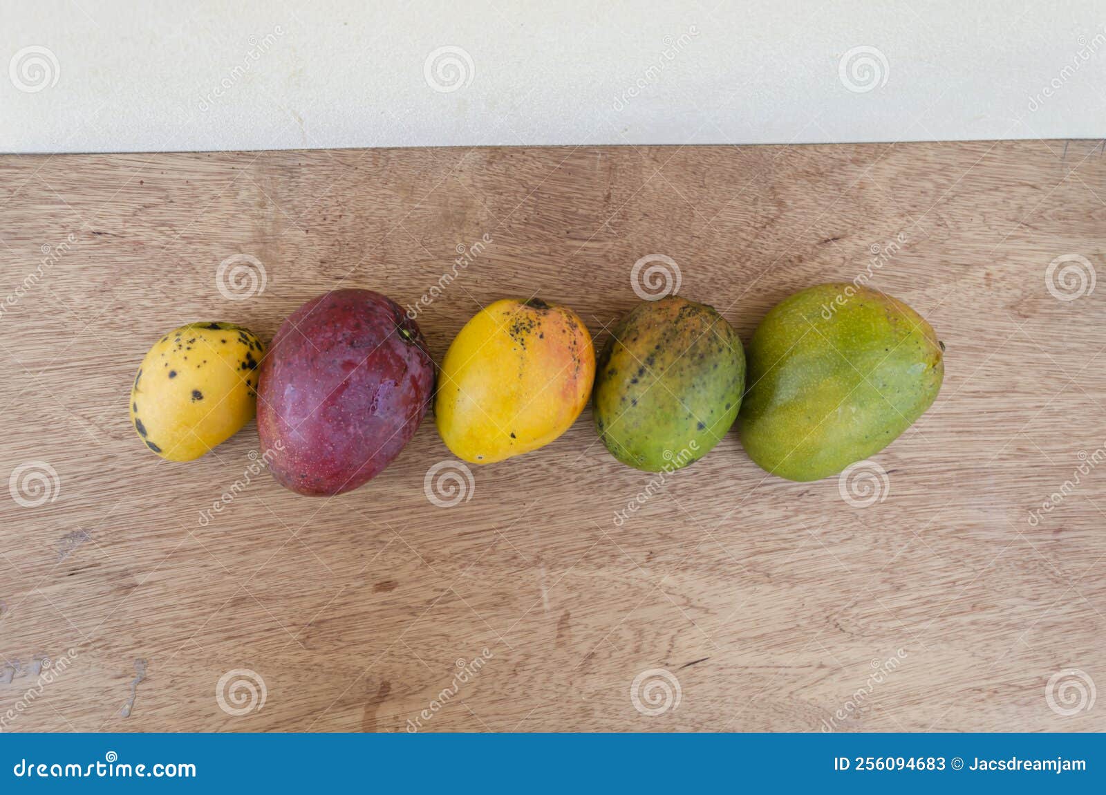 Horizontal Line of Mangoes stock image. Image of fresh - 256094683