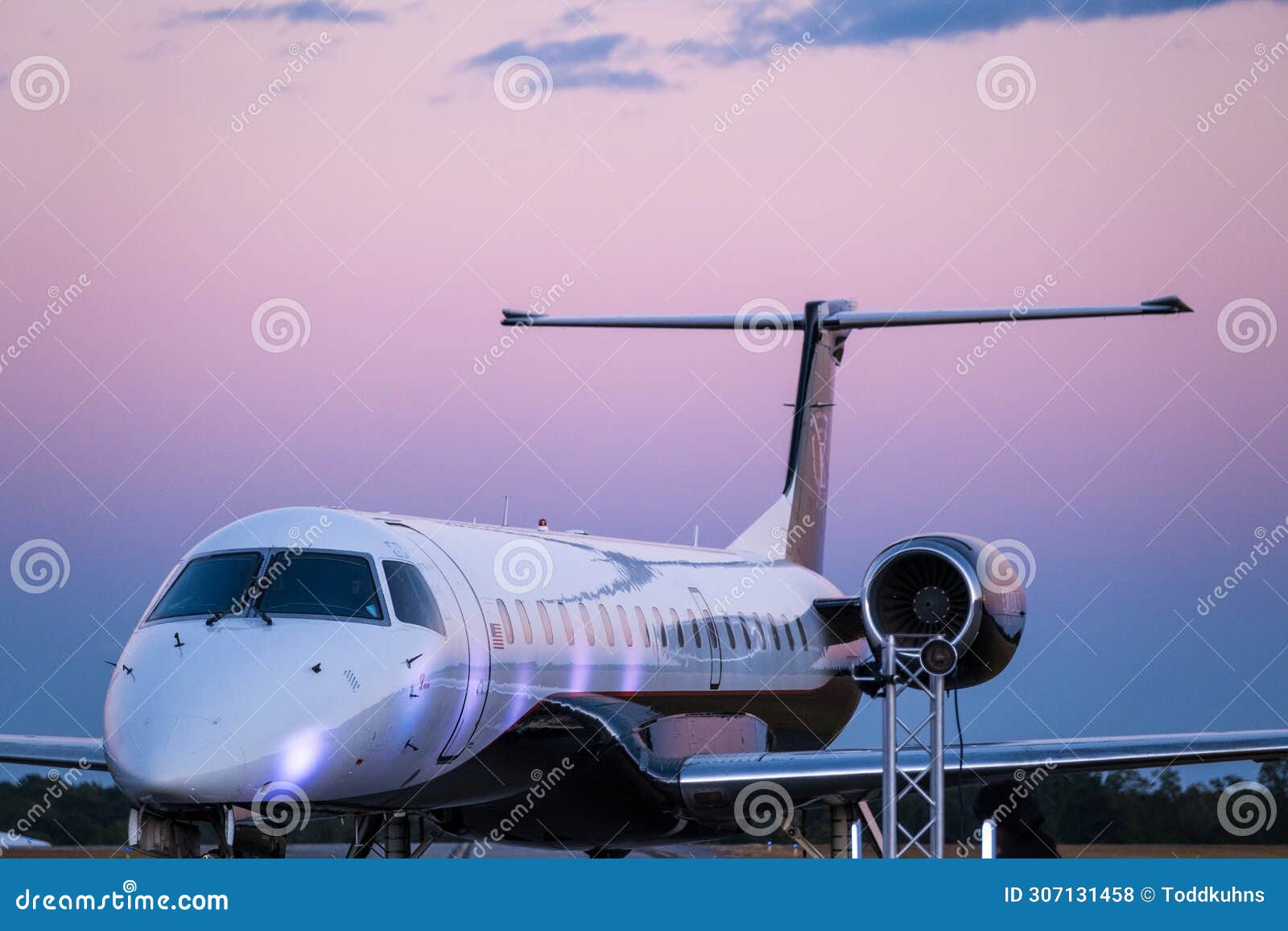 Small Jet Airplane on Runway at Sunset Stock Photo - Image of aircraft ...