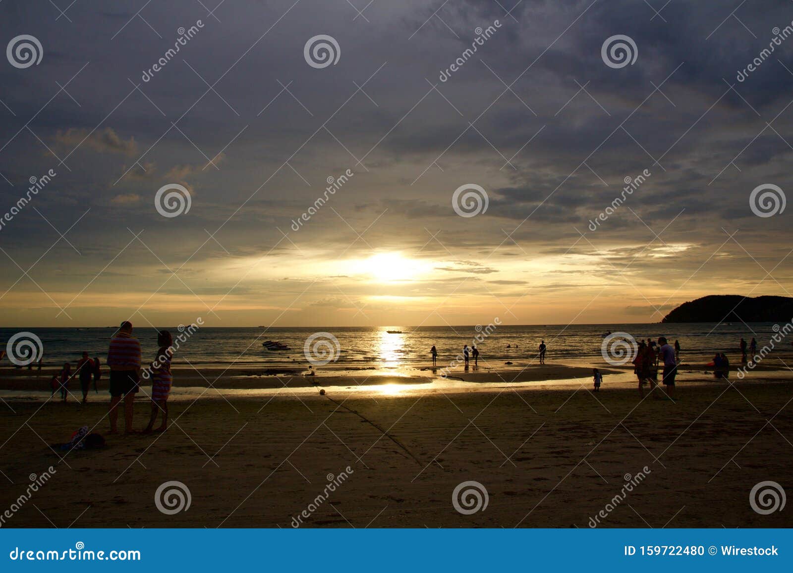 Horizontal Shot of the Beach and the Sea during Sunset with People ...