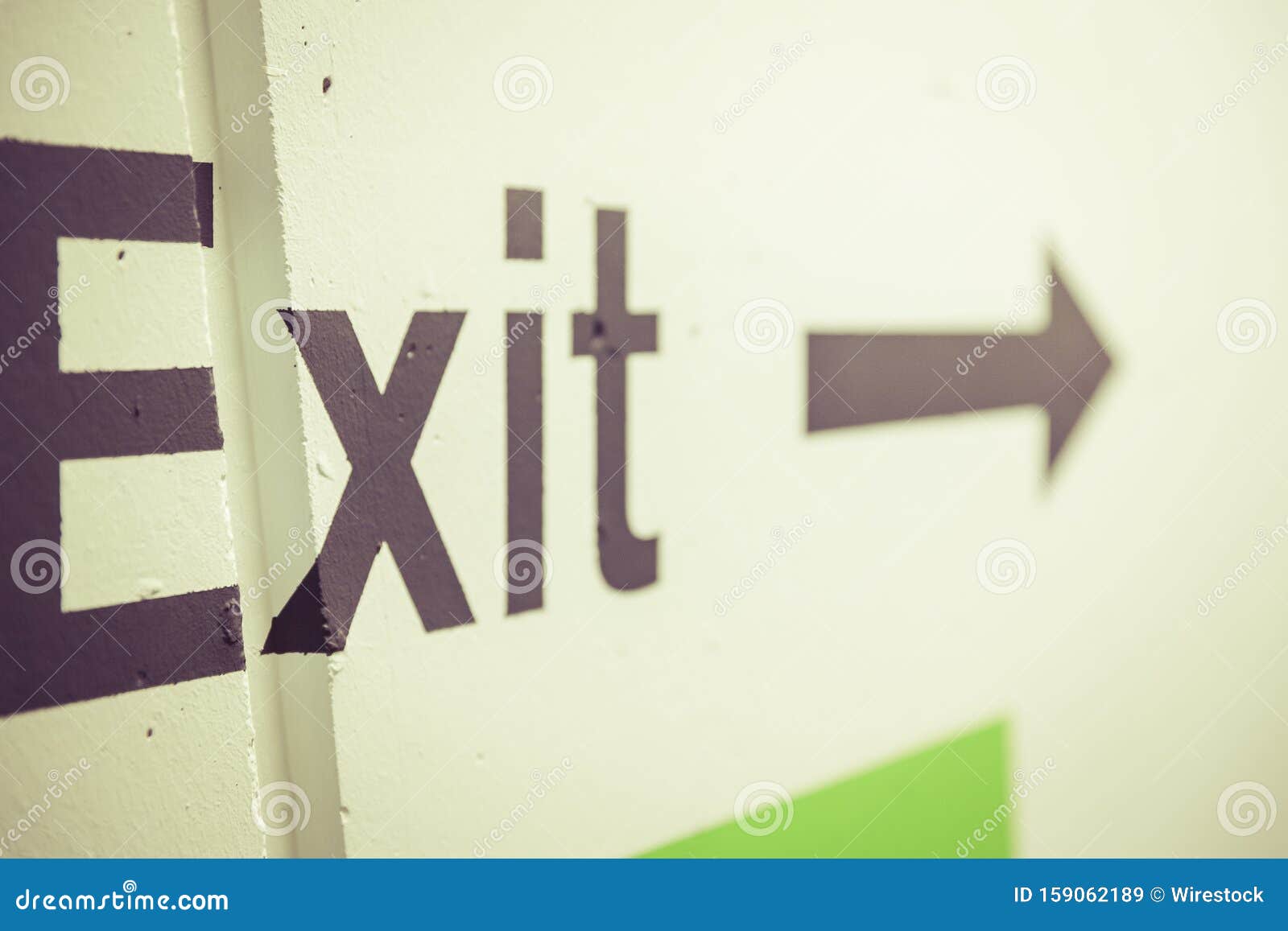 Horizontal Shot of an Exit Sign with an Arrow on the White Wall Stock ...