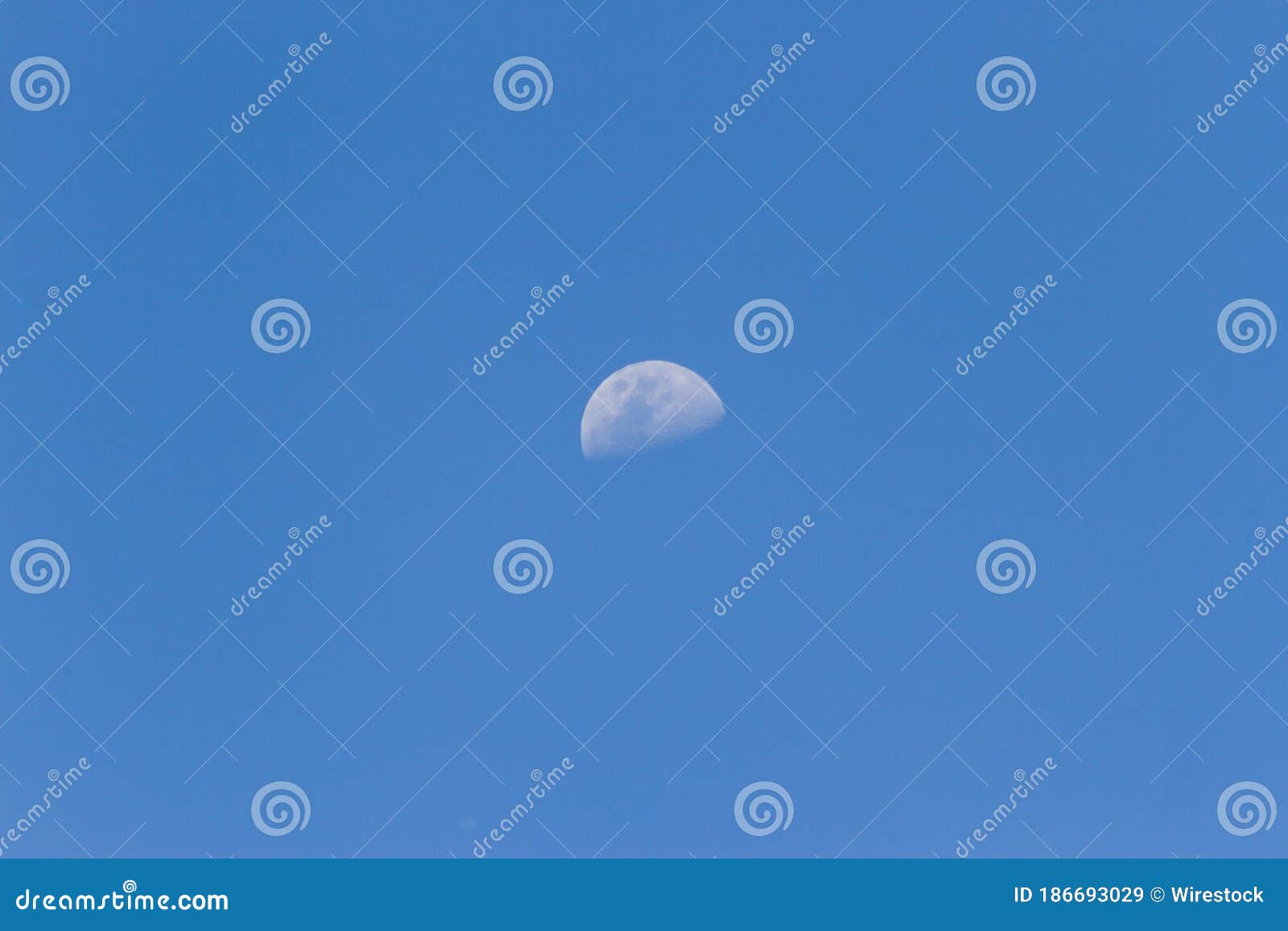 Horizontal Shot of a Half-moon Visible during Daylight in the Blue Sky ...