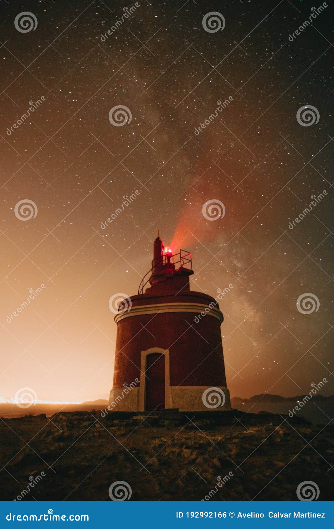 An Horizontal Shot of a Lighthouse during the Night with the Milky Way ...