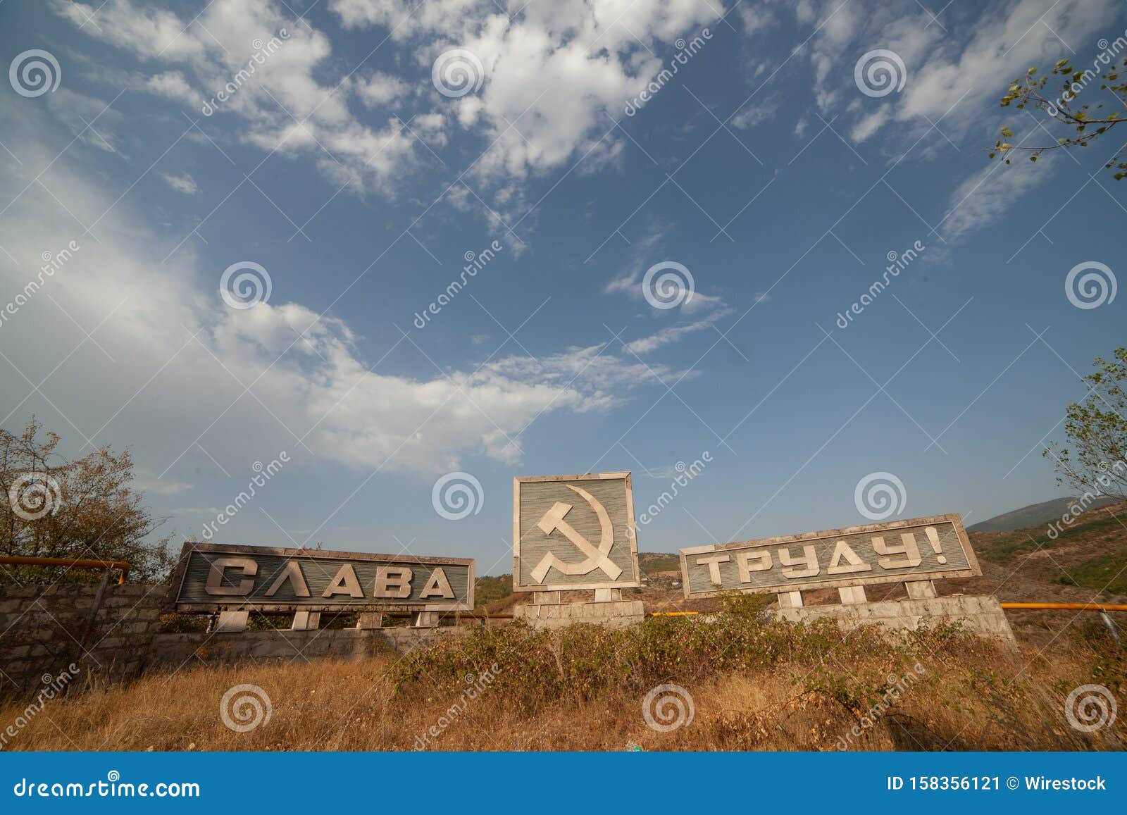 Horizontal Shot of a Sign Praise Hard Work Under the Beautiful Cloudy ...
