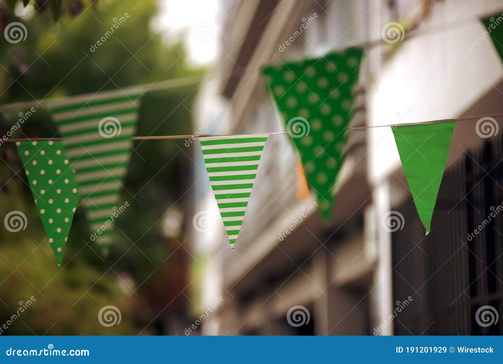 Horizontal Shot of Small Green Decorative Flags on a Blurred Background ...
