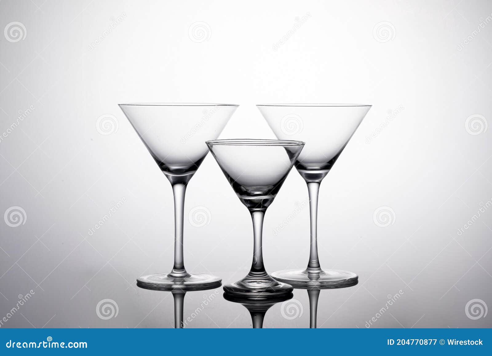 Horizontal Shot of Three Cocktail Glasses on the White Surface with ...