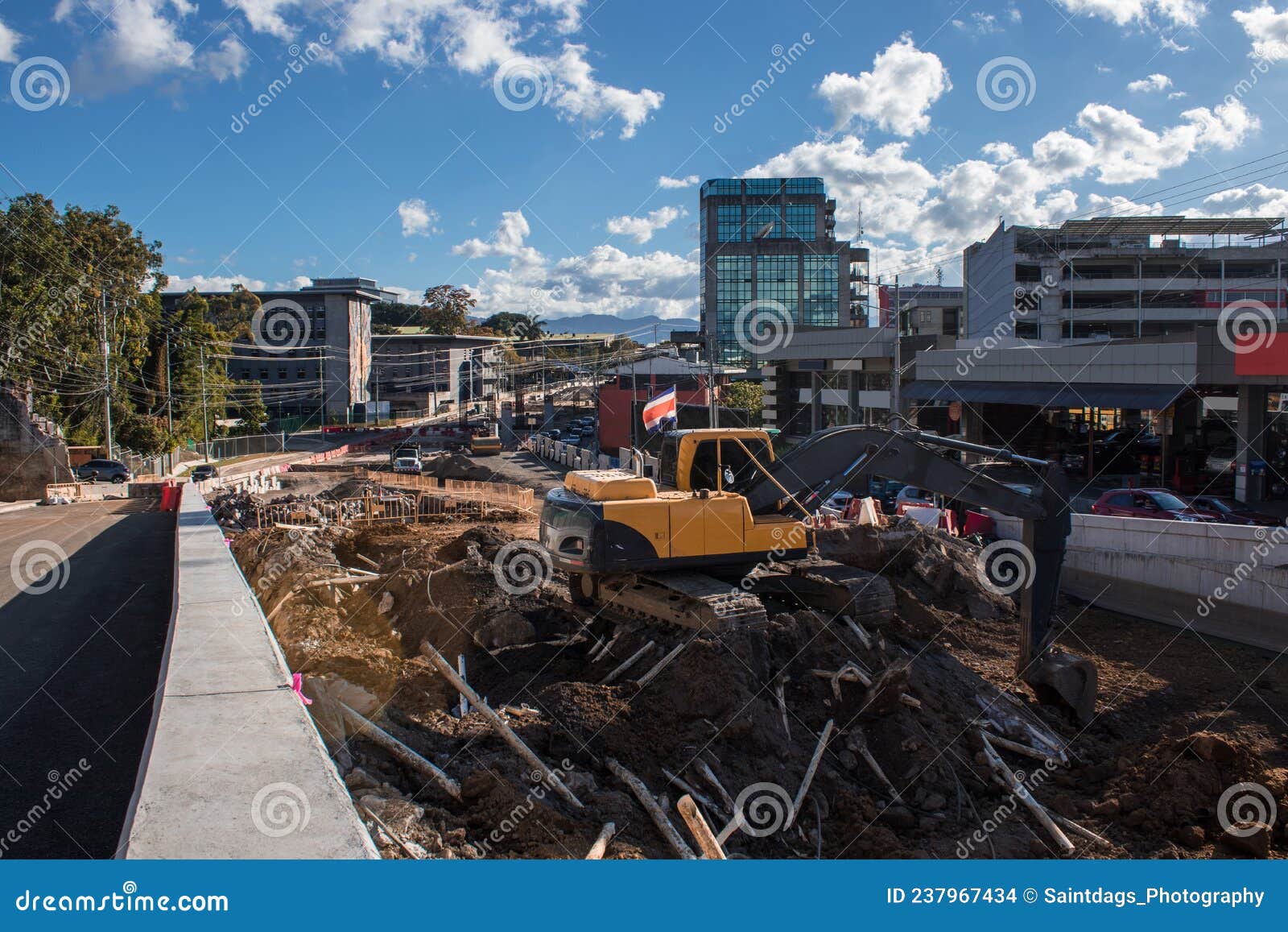 Horizontal Shot of Tractor Working on Urban Road Construction in the ...