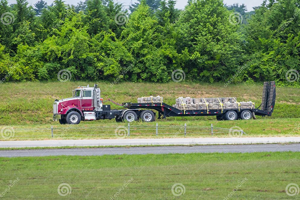 Flatbed 18-Wheeler Carrying Load of Stone for Construction Stock Photo ...