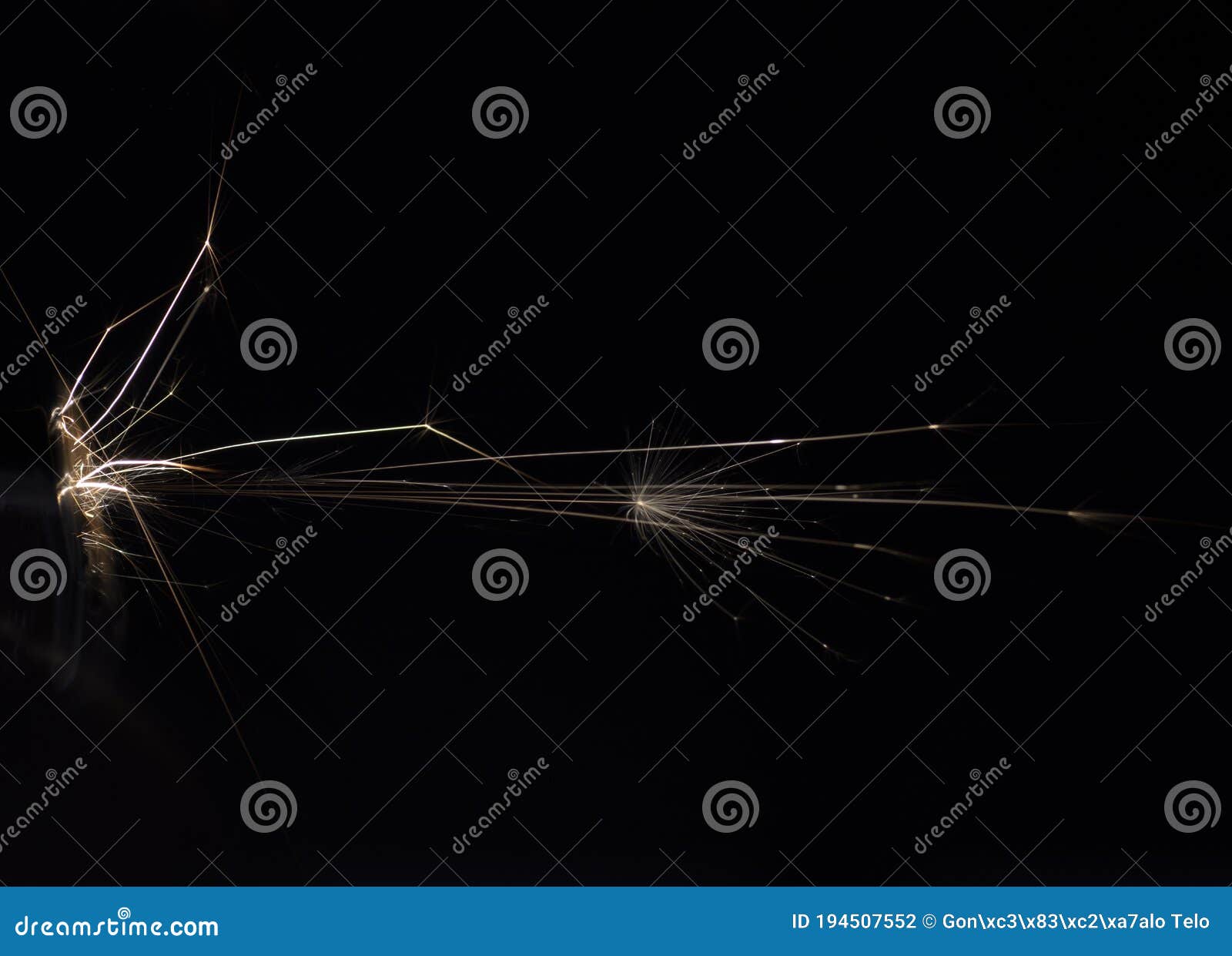 Horizontal Sparks Fly from Lighter with Black Background Stock Photo ...