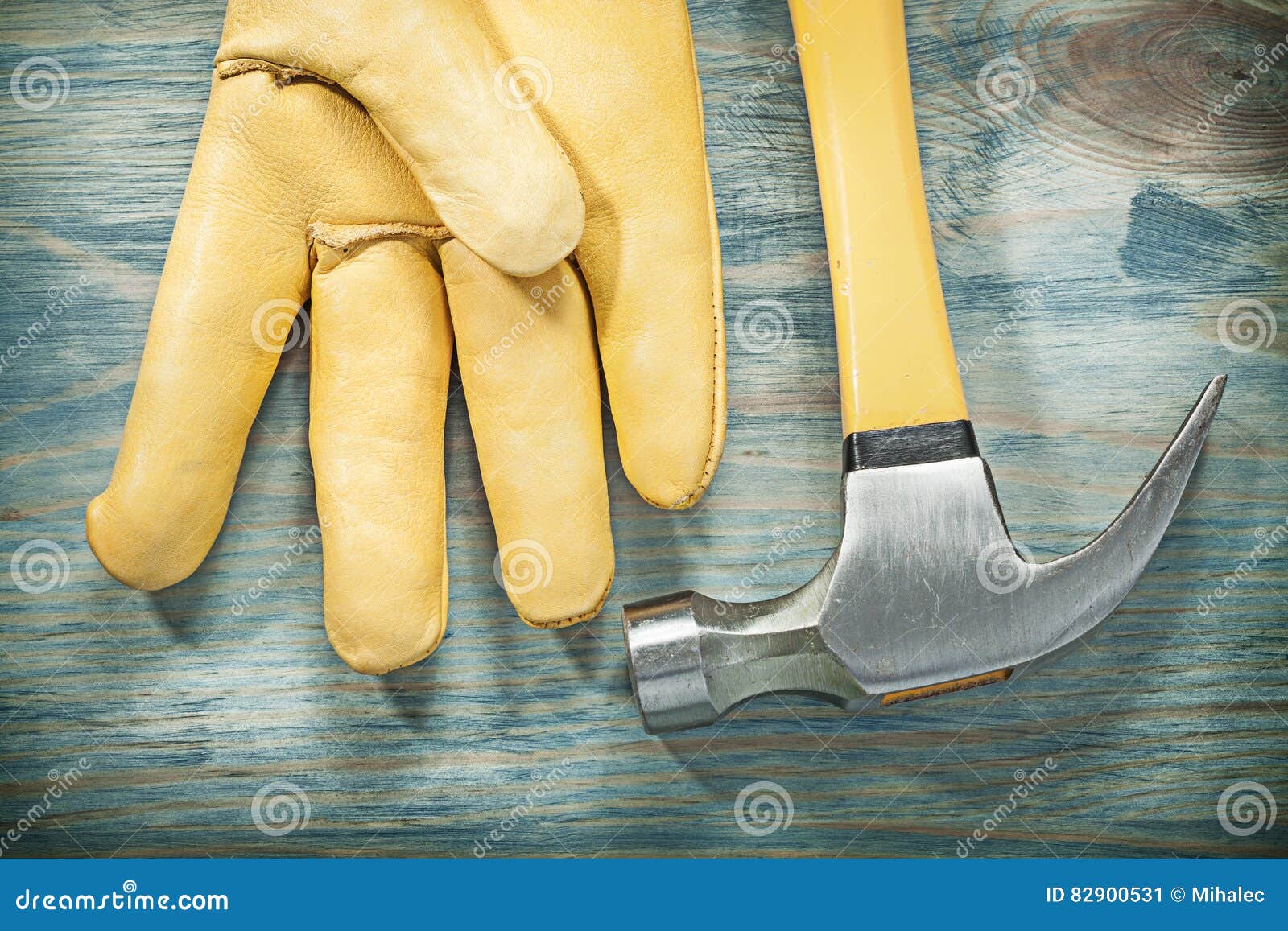 Horizontal Version of Claw Hammer Leather Safety Glove on Wooden Stock ...